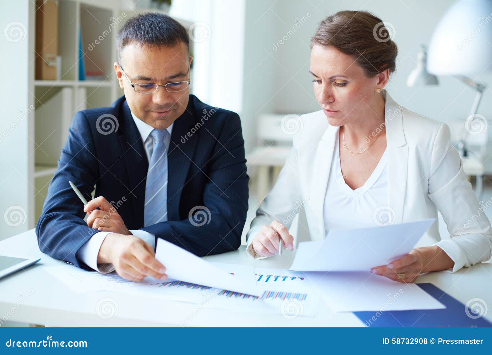 Discussing papers stock photo. Image of idea, modern - 58732908