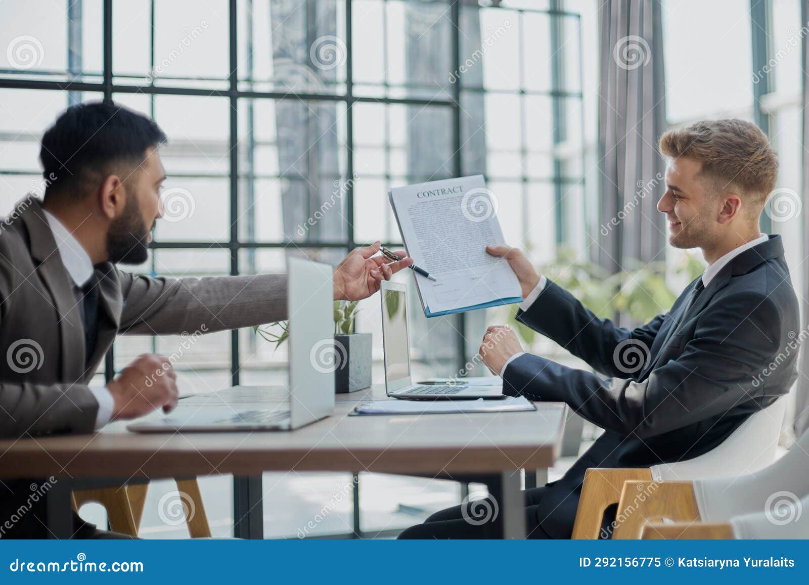 Two Happy Men Working Together on a New Business Project Stock Image ...