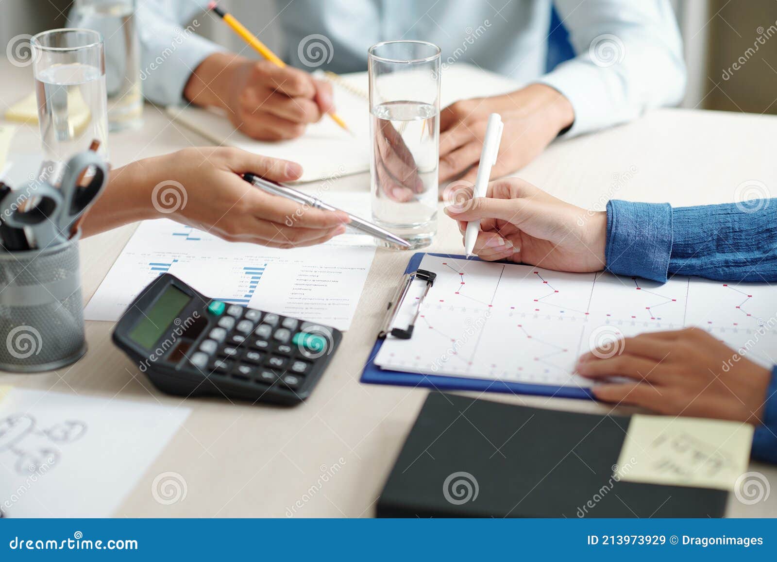 Discussing project work stock image. Image of closeup - 213973929