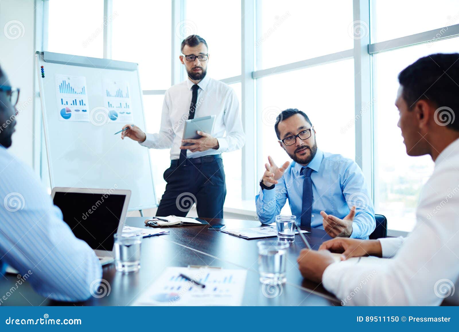 Discussing Statistics with Colleagues Stock Photo - Image of ...