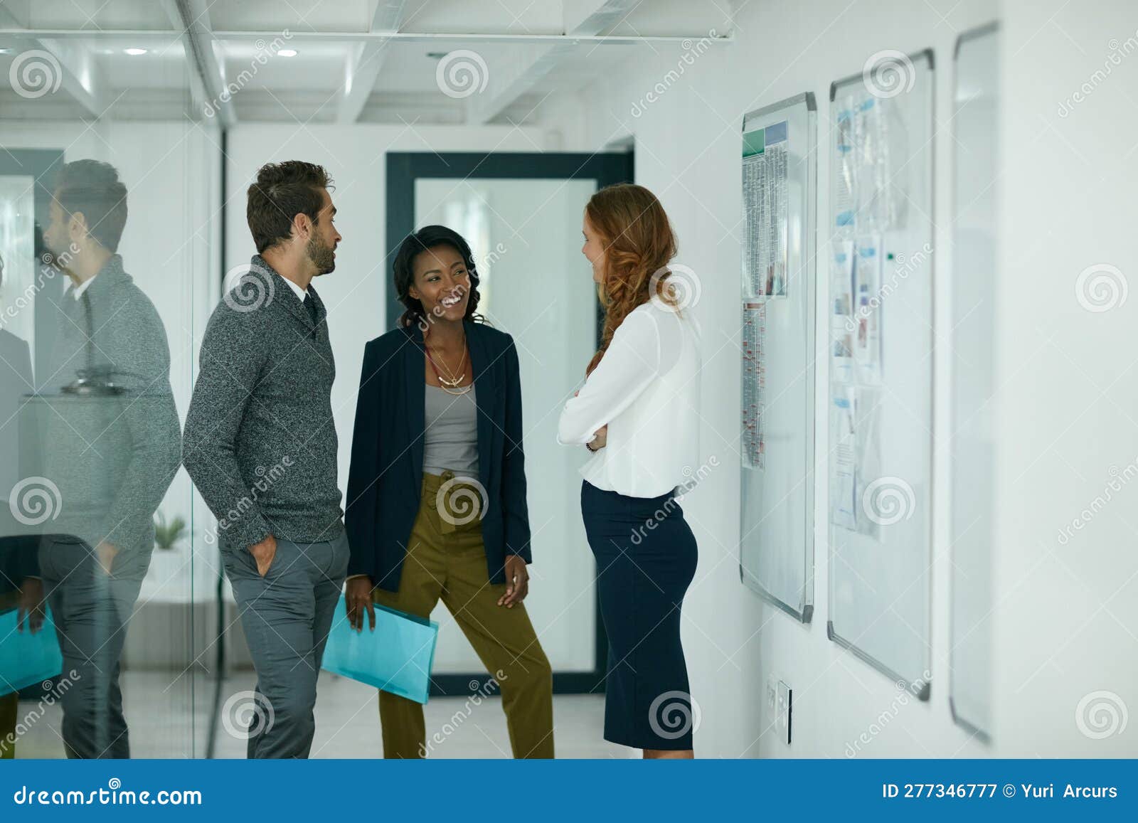 Discussing Their Latest Project Updates. Colleagues Having a Discussion ...