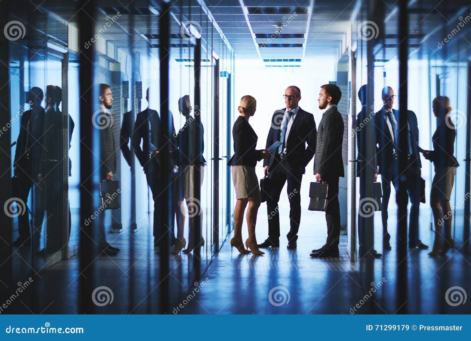 Discussing Work in Corridor Stock Image - Image of formal, corridor ...