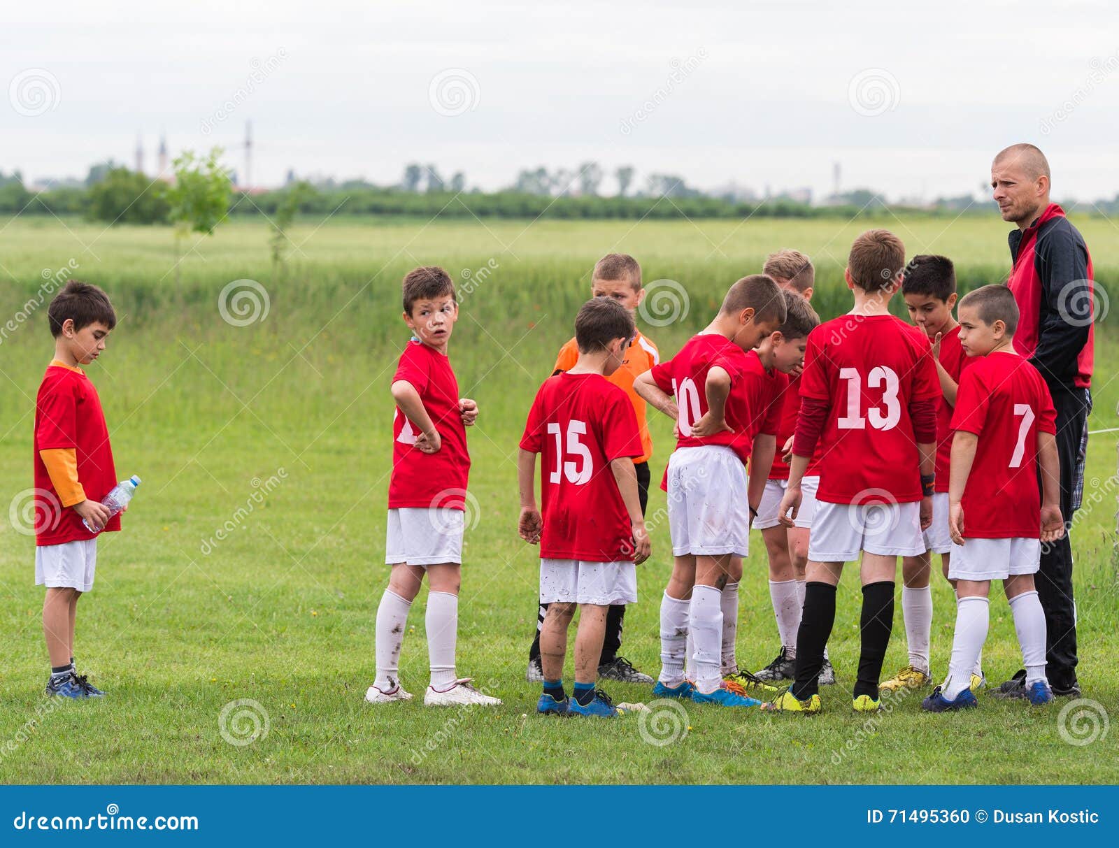 Discussion of the Kid Soccer Team Stock Photo - Image of adult, grass ...