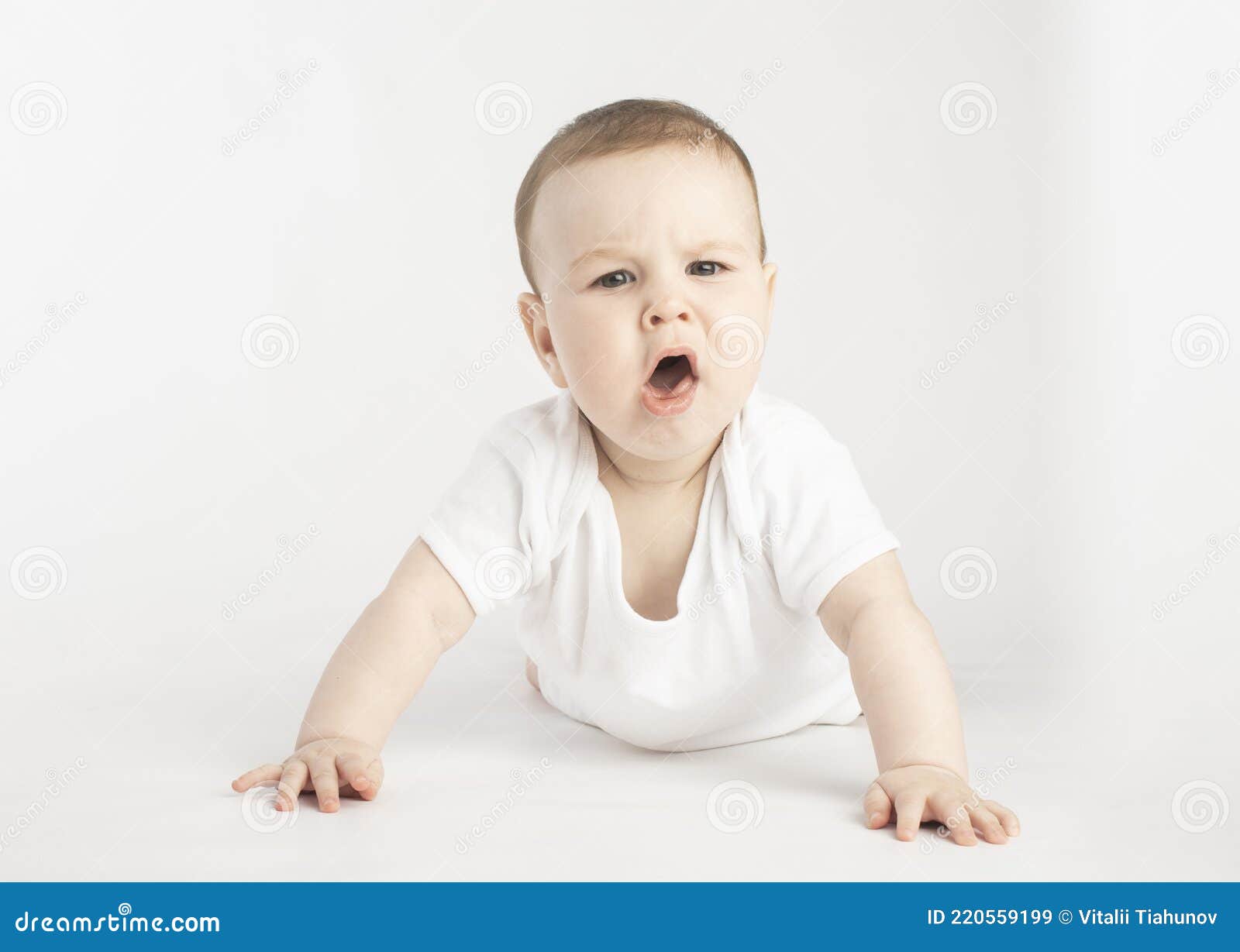 Disgruntled Baby Looking at the Camera Stock Image - Image of onstomach ...