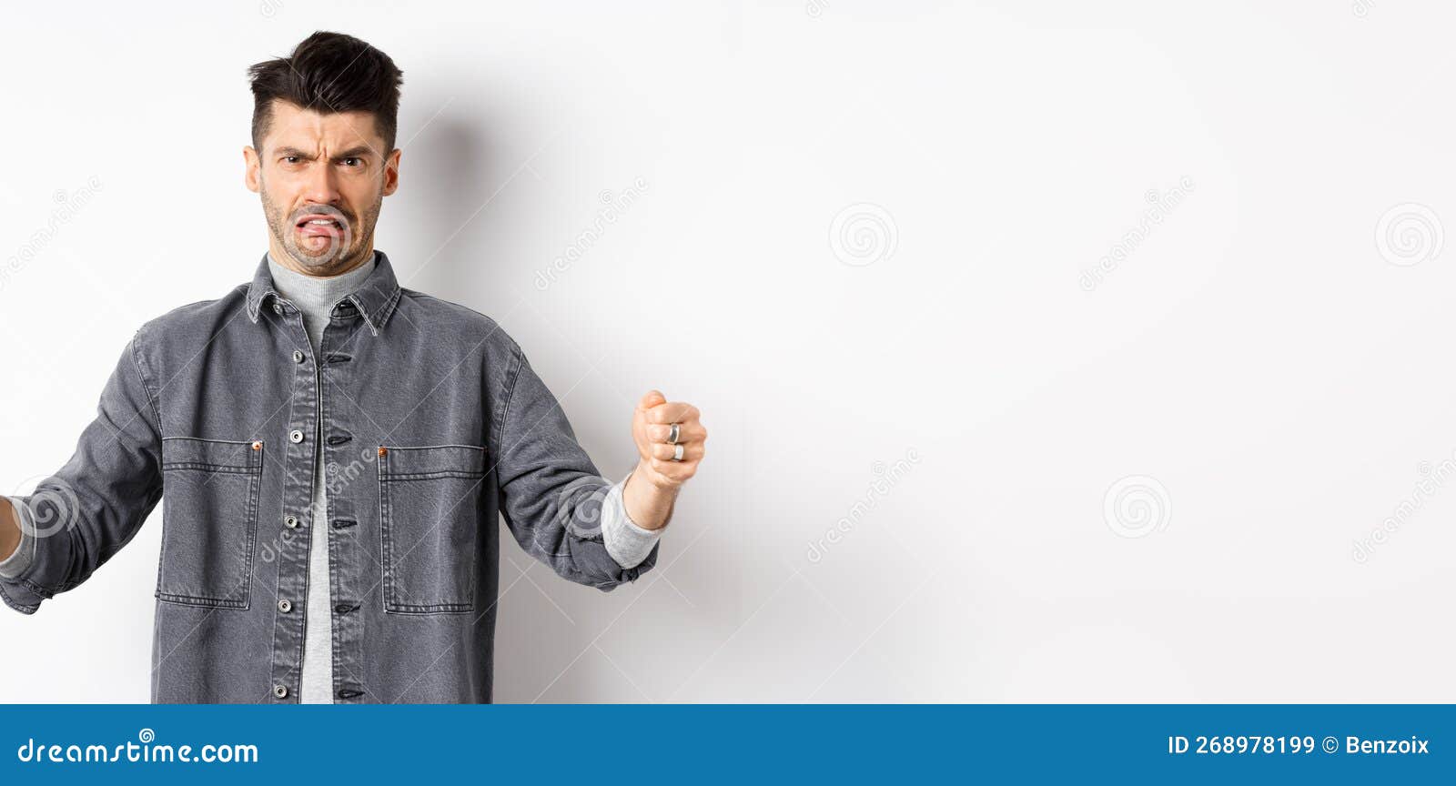 Disgusted Guy Showing Big Size Object and Grimacing from Dislike and ...