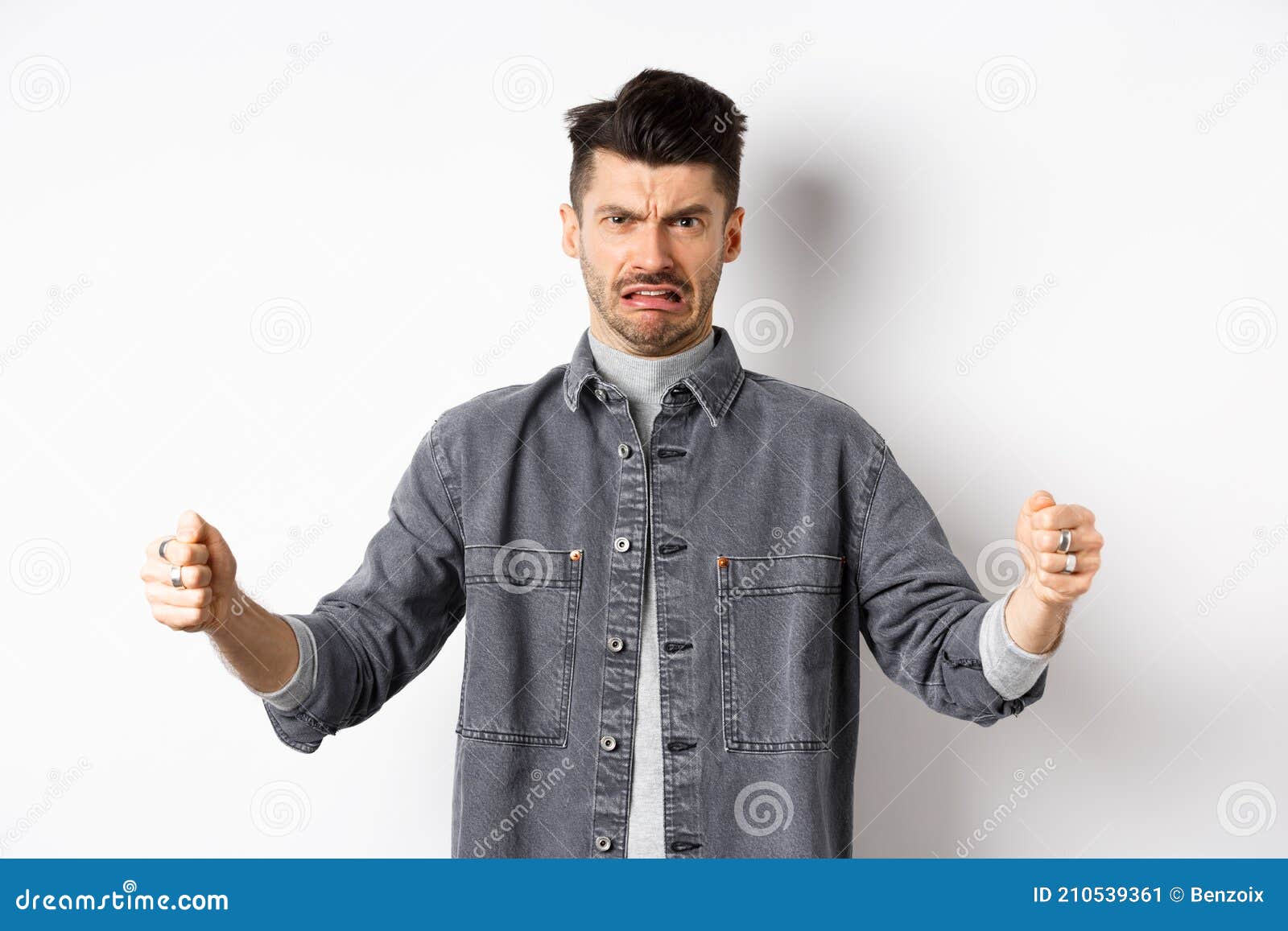 Disgusted Guy Showing Big Size Object and Grimacing from Dislike and ...