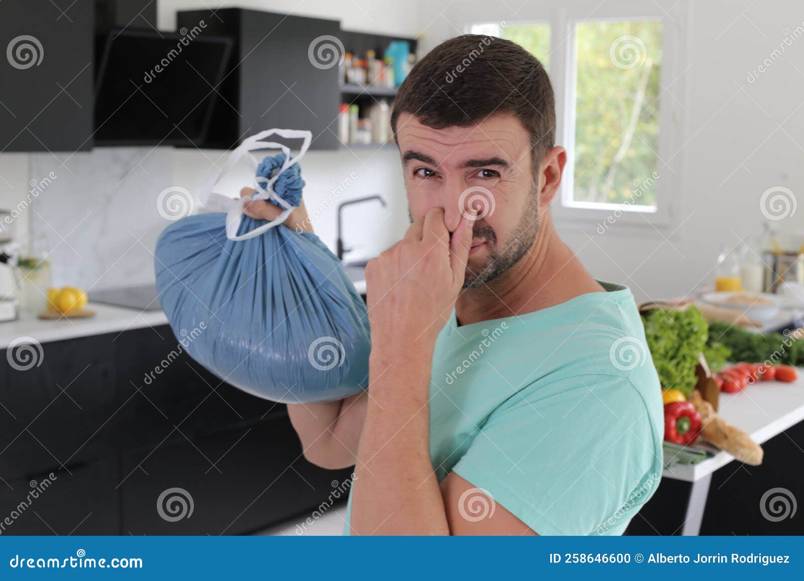 Disgusted Man Holding Stinky Garbage Bag Stock Photo - Image of ...