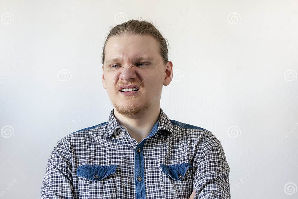 Disgusted Man in a Plaid Shirt. Isolate on White Background Stock Photo ...