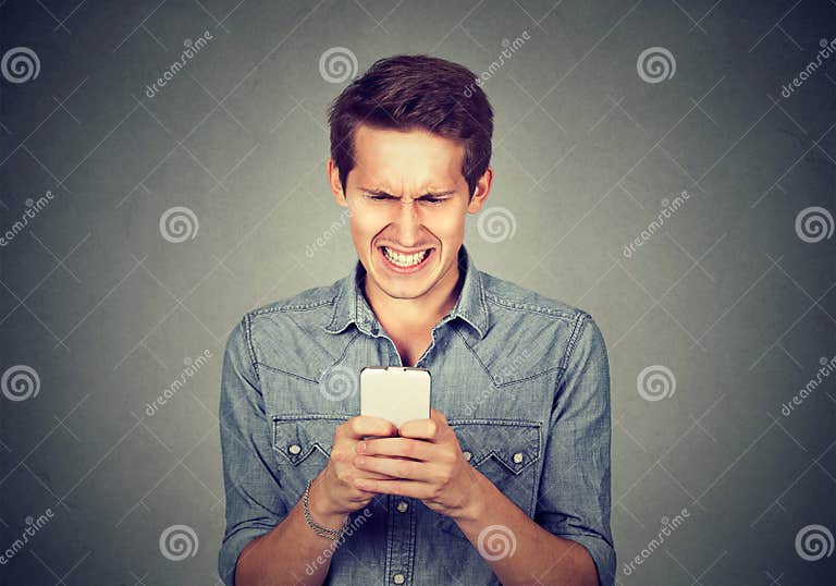 Disgusted Man Reading a Text Message Stock Photo - Image of message ...