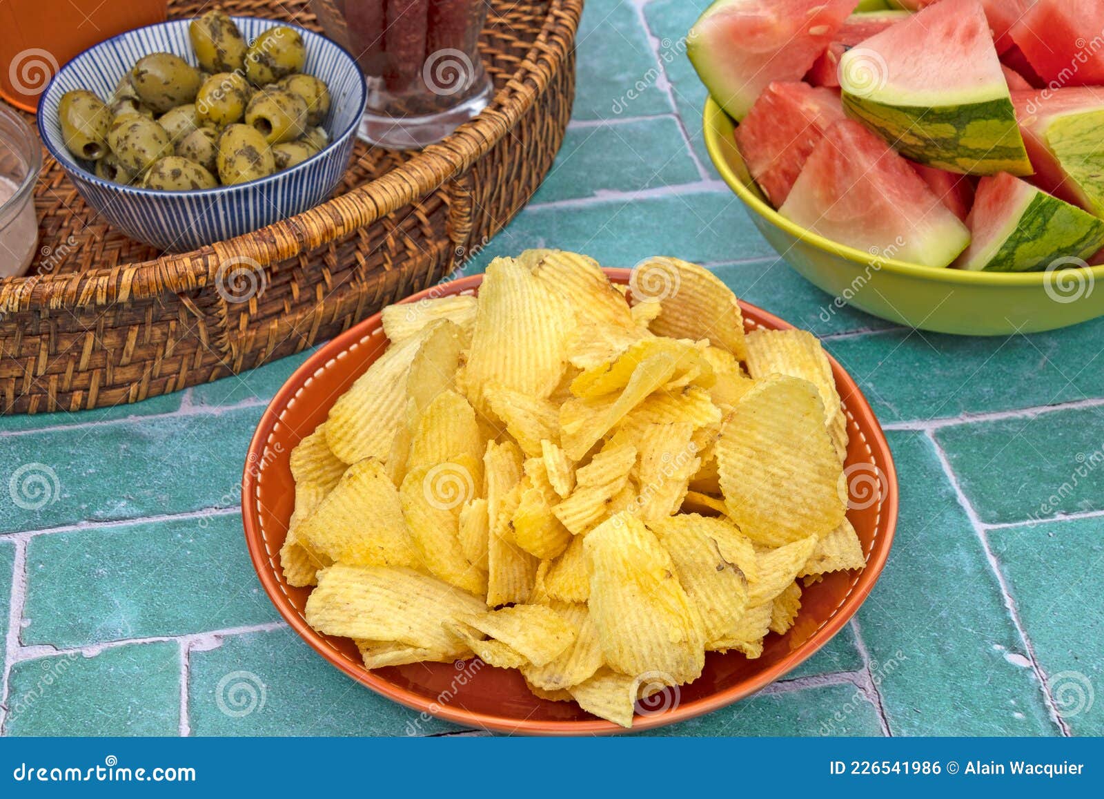 Dish of crisps on a table stock photo. Image of tasty - 226541986