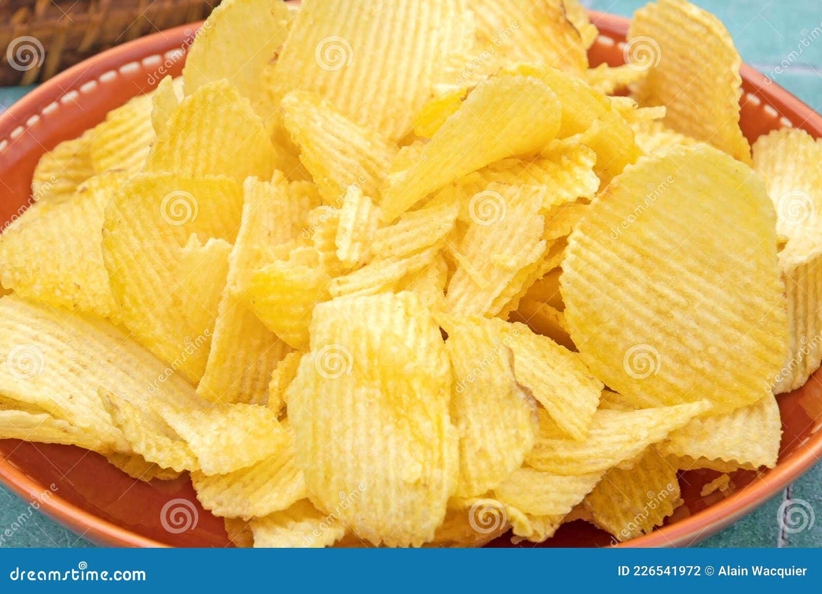 Dish of crisps on a table stock photo. Image of yellow - 226541972