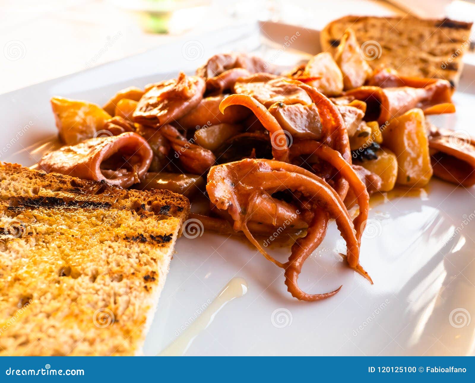 Dish of Cuttlefish and Octopus with Toasted Bread Stock Photo - Image ...