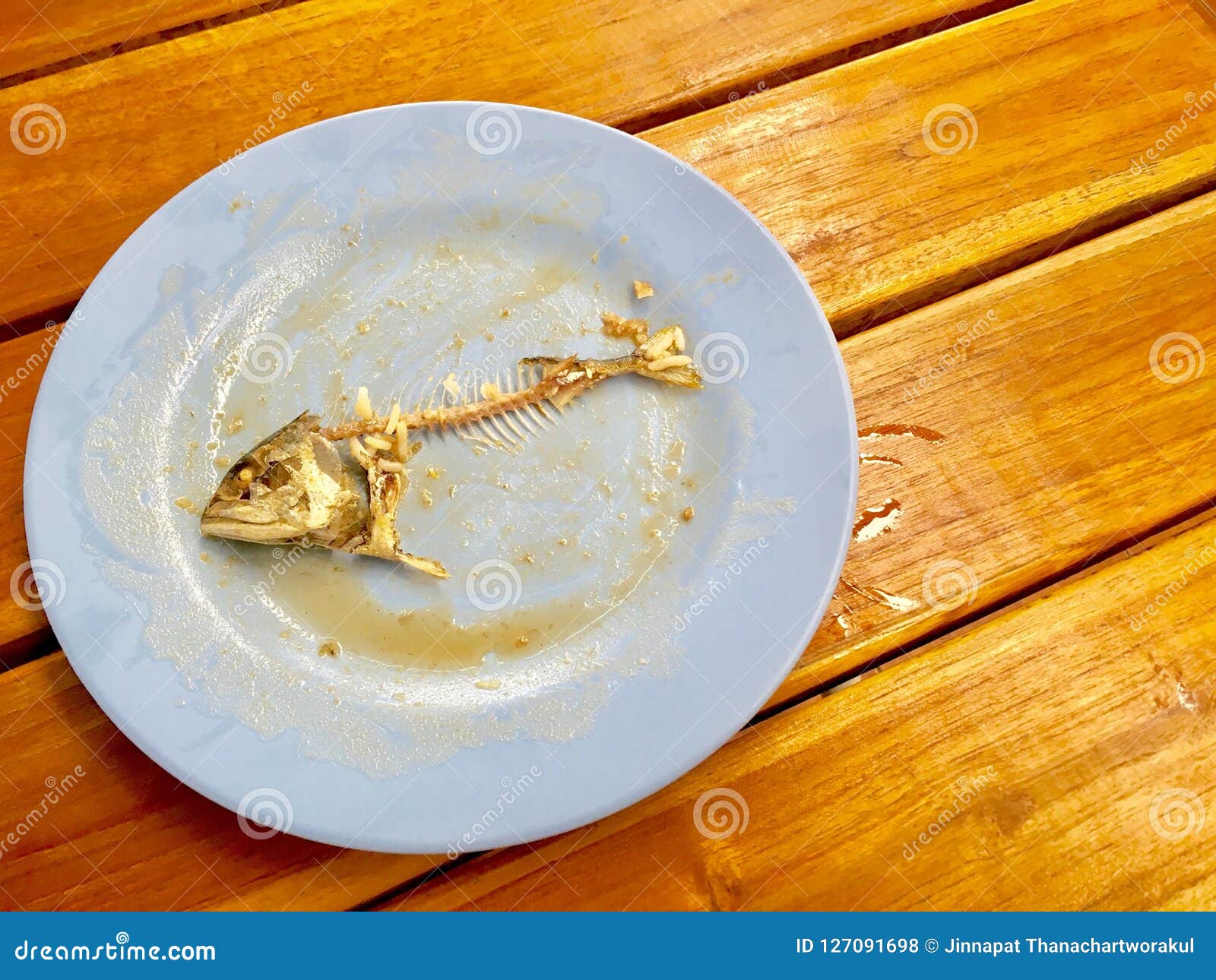 Fishbone on dirty dish stock photo. Image of white, view - 127091698