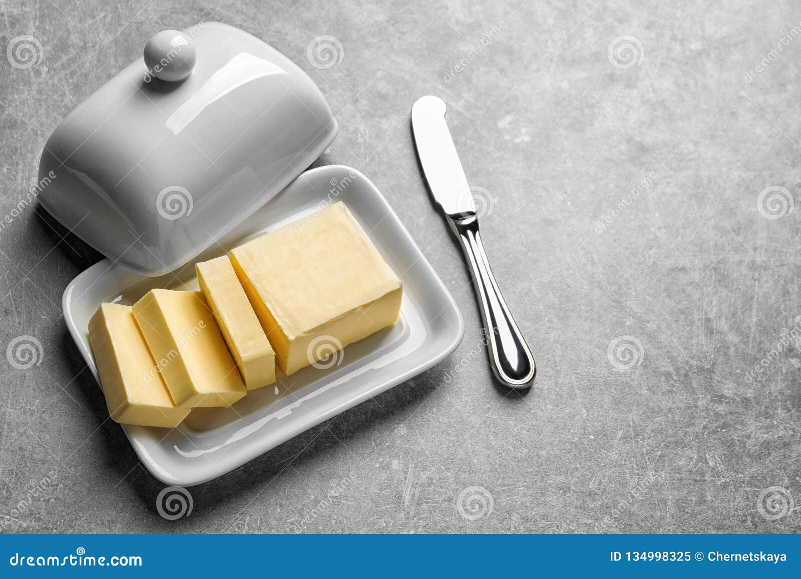 Dish with Fresh Butter and Knife on Table Stock Image - Image of knife ...