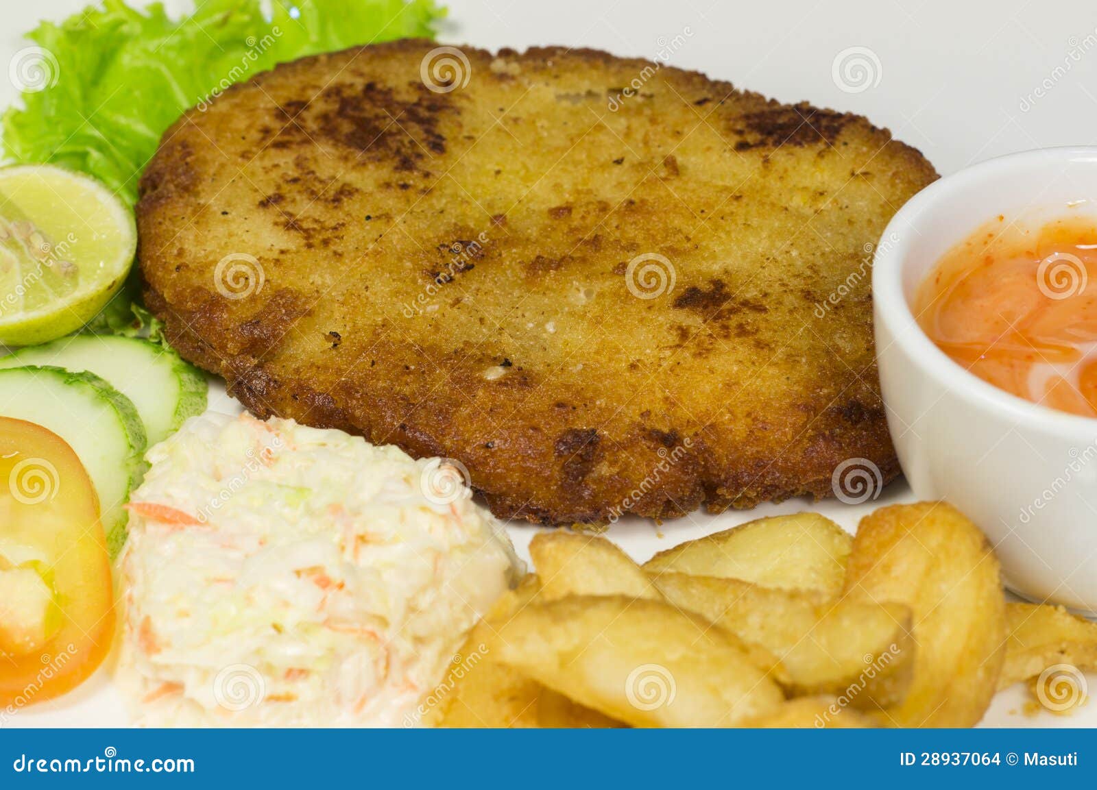 Dish of Fried Fish Filled with Wedges, Coslow and Sauce Stock Photo ...