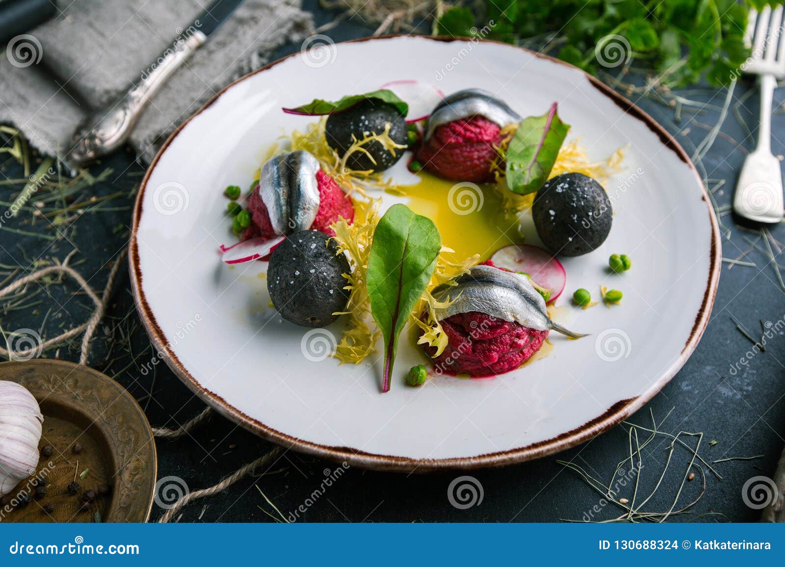 A Dish of Herring and Fresh Vegetables Cooked by a Chef Stock Photo ...