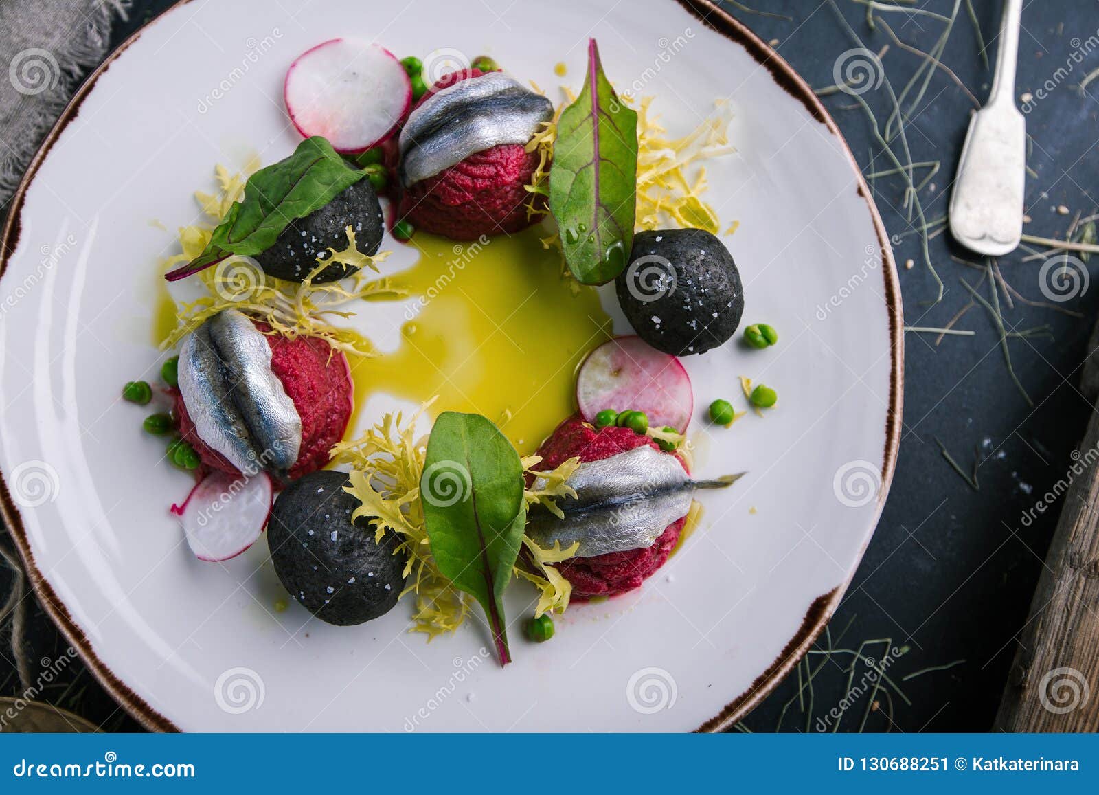 A Dish of Herring and Fresh Vegetables Cooked by a Chef Stock Image ...