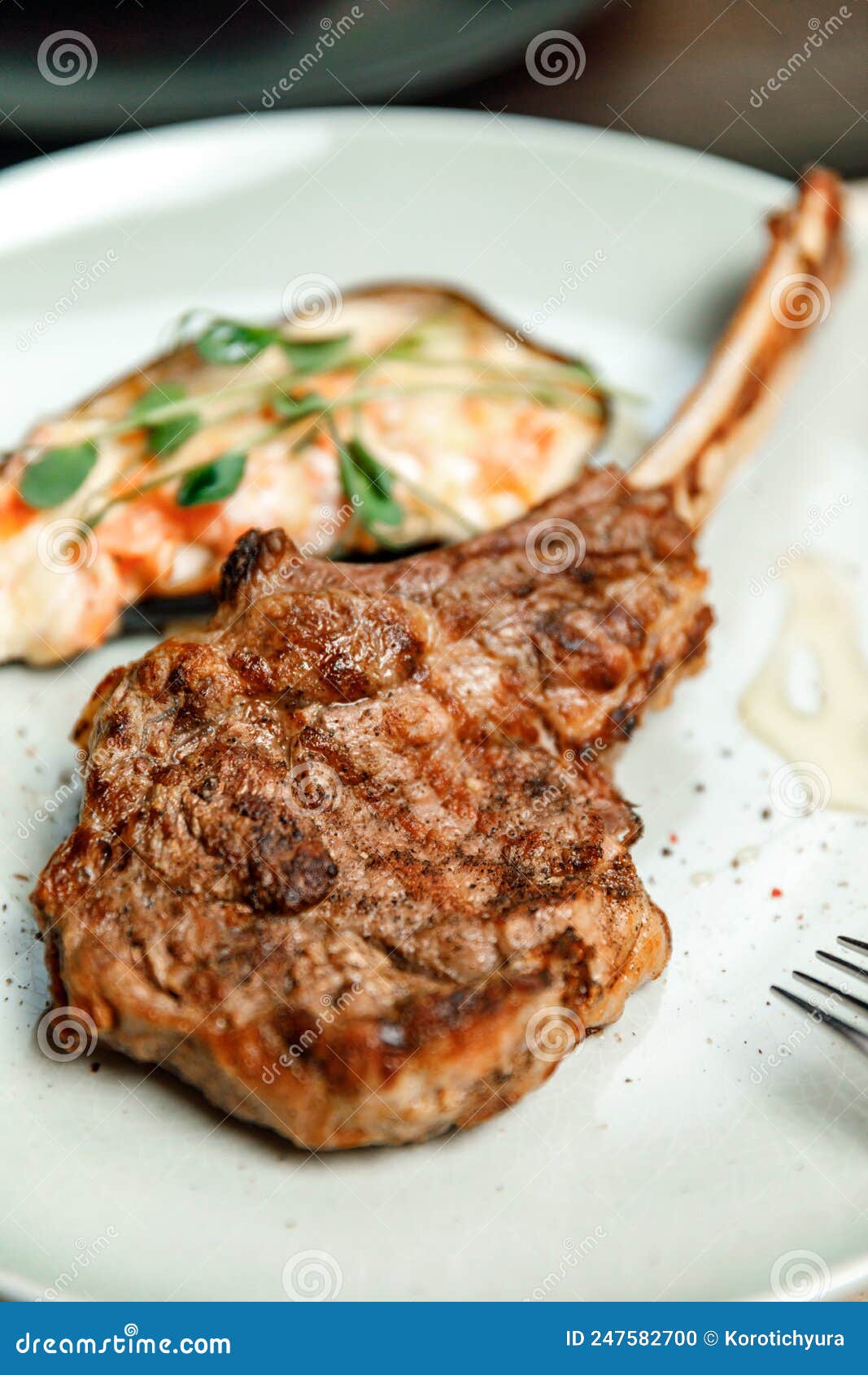 Dish Plate with Meat Steak on the Bone in the Restaurant Stock Photo ...