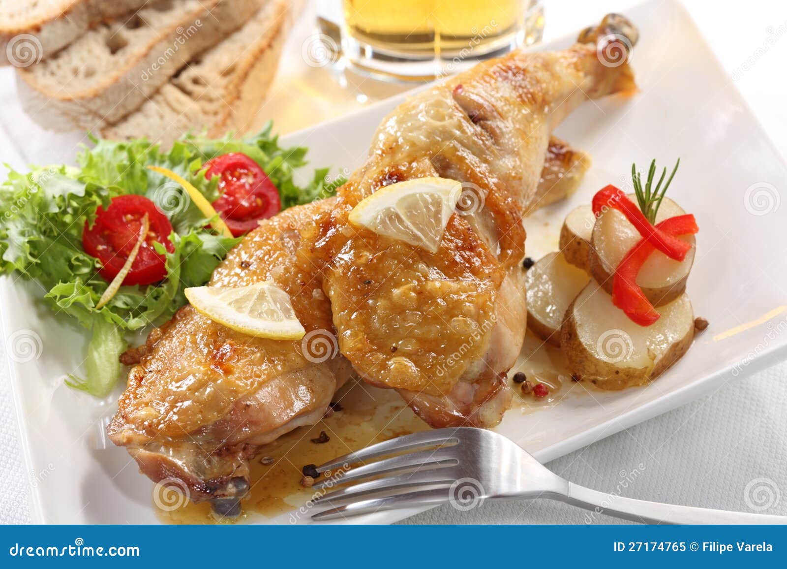 Dish of Two Roasted Chicken Legs Stock Image - Image of food, lemonl ...