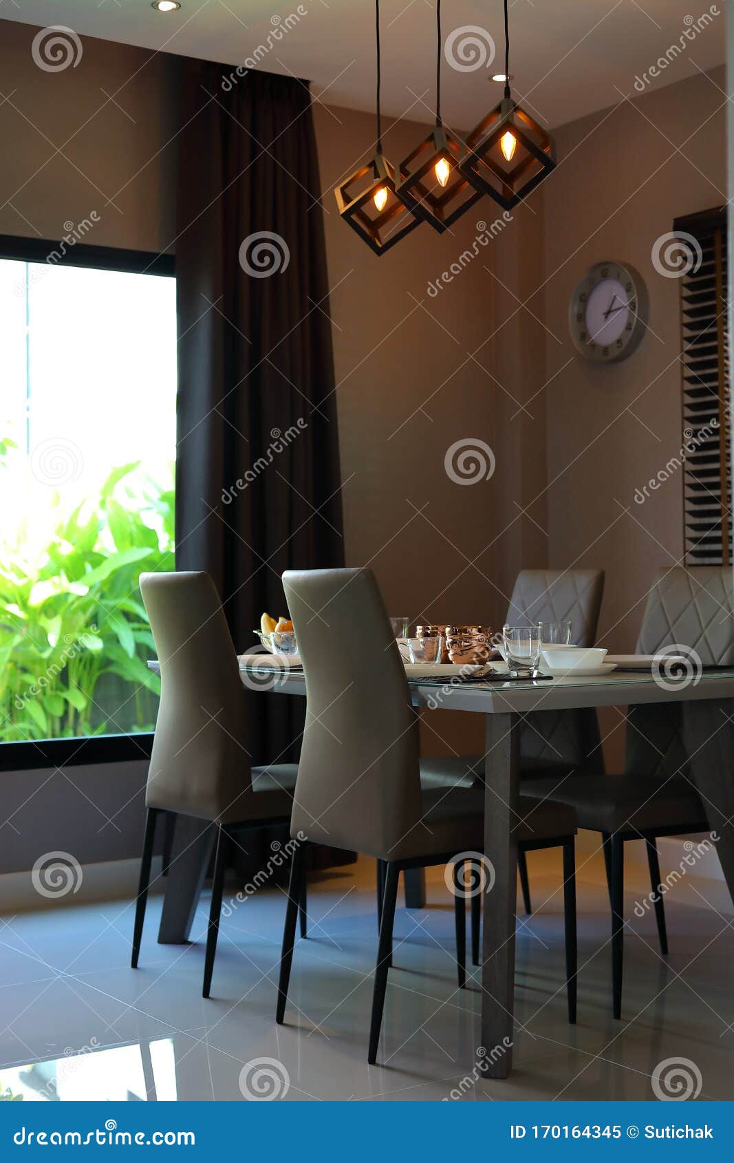 Dish Ware Sets Arrange on Dining Table Inside Eating Room of Modern ...