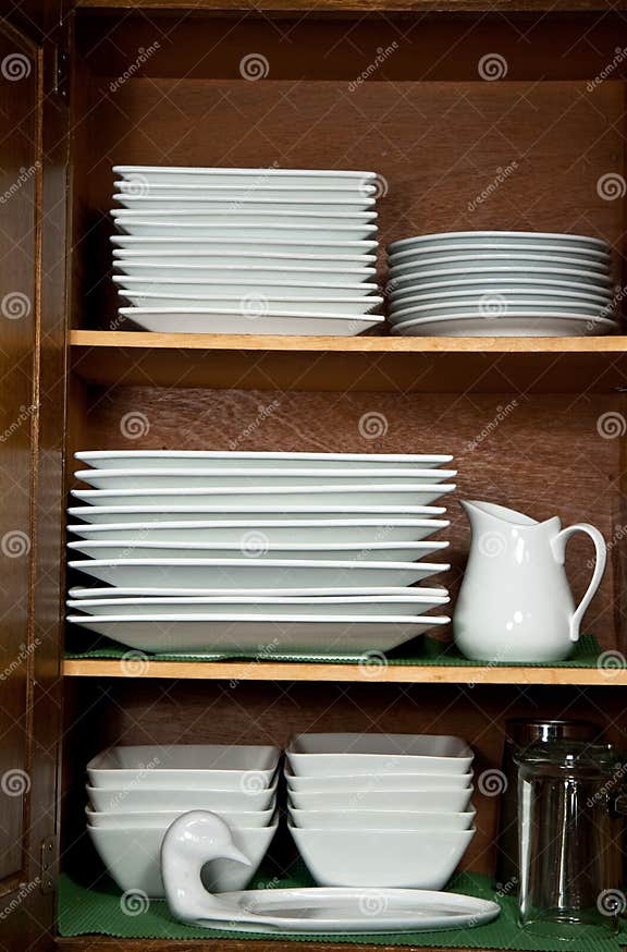 Dishes in Kitchen Cabinet stock image. Image of lunch - 8011981
