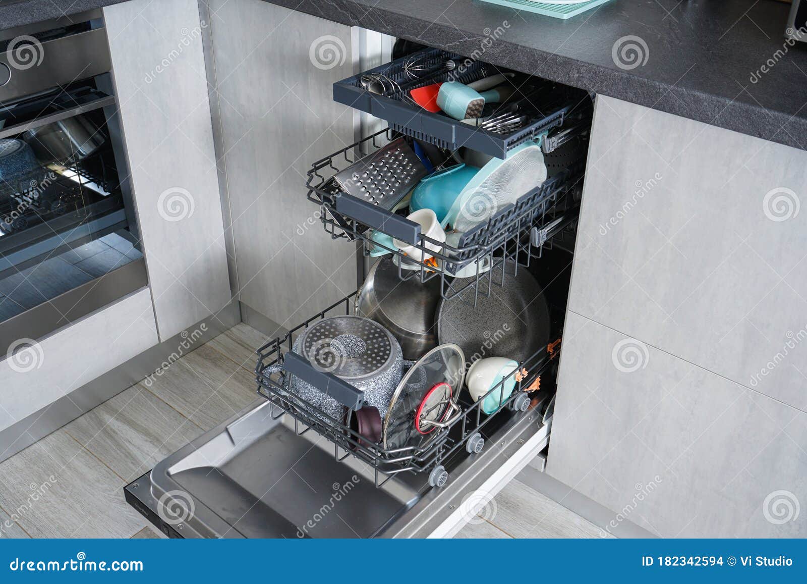 Dishwasher Machine, Open and Loaded with Dishes in the Kitchen, after ...