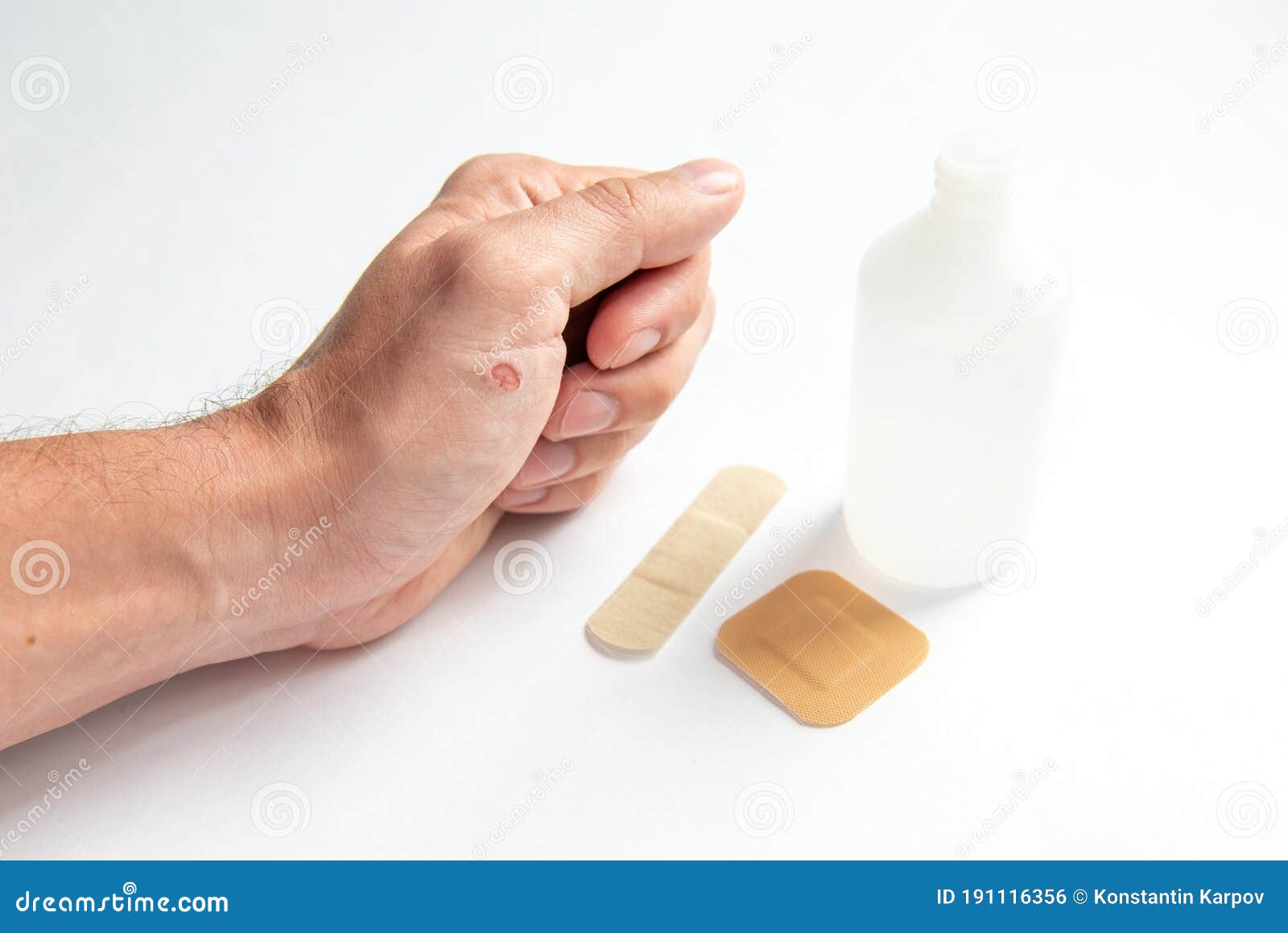 Disinfecting the Wound on the Hand and Applying a Patch Stock Photo ...