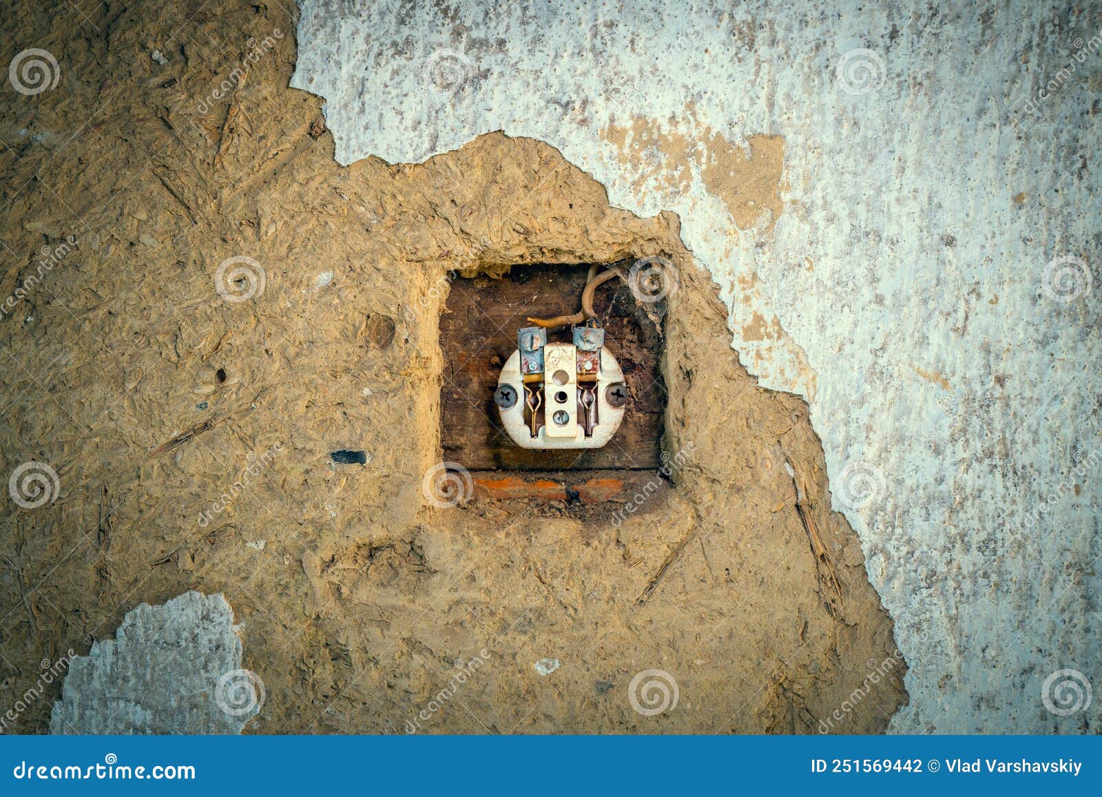 Dismantled Bare Electrical Socket in an Old Mud Rural Wall Stock Photo ...