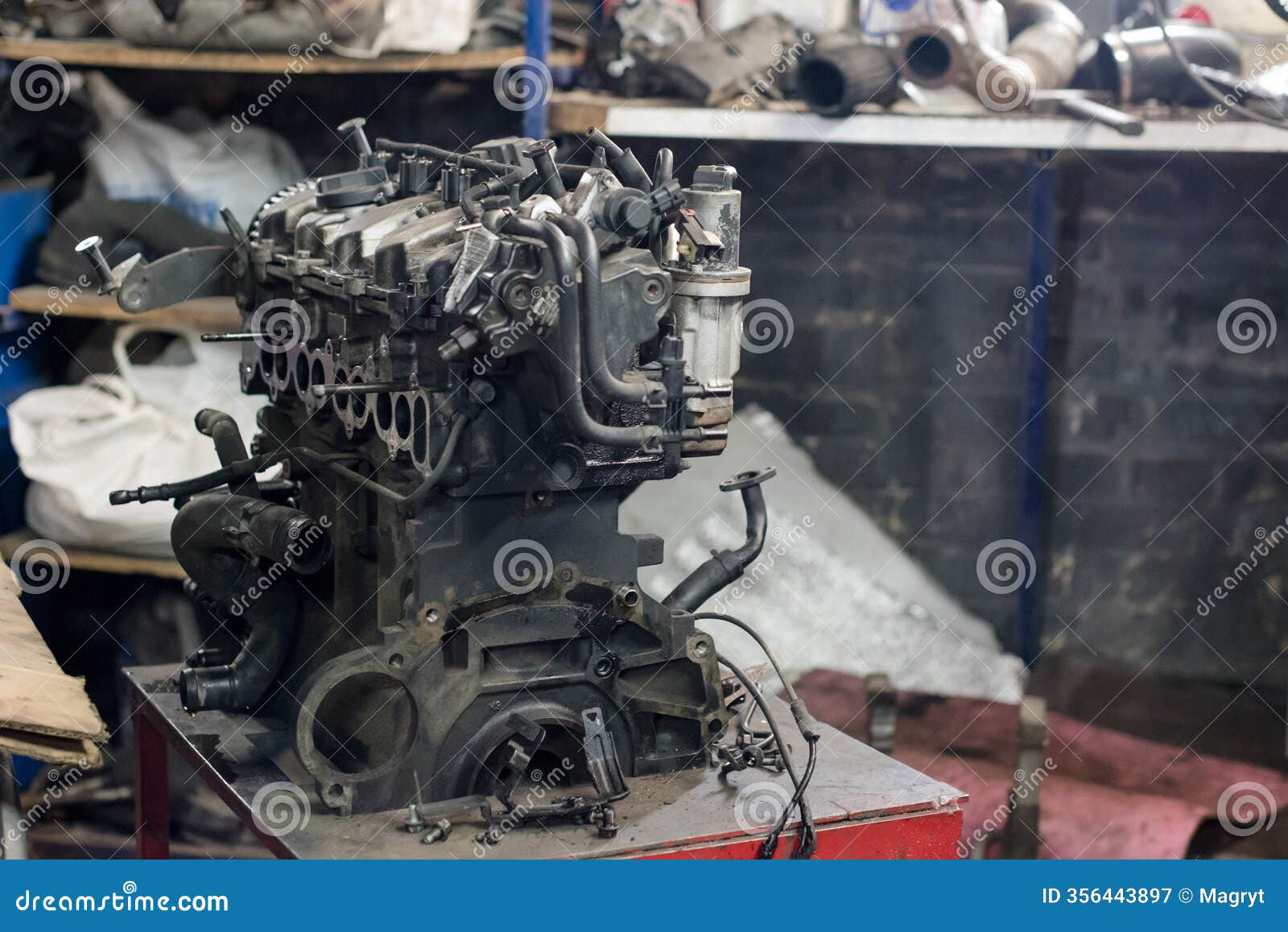 Dismantled Car Engine Placed on a Wooden Pallet Inside a Garage ...