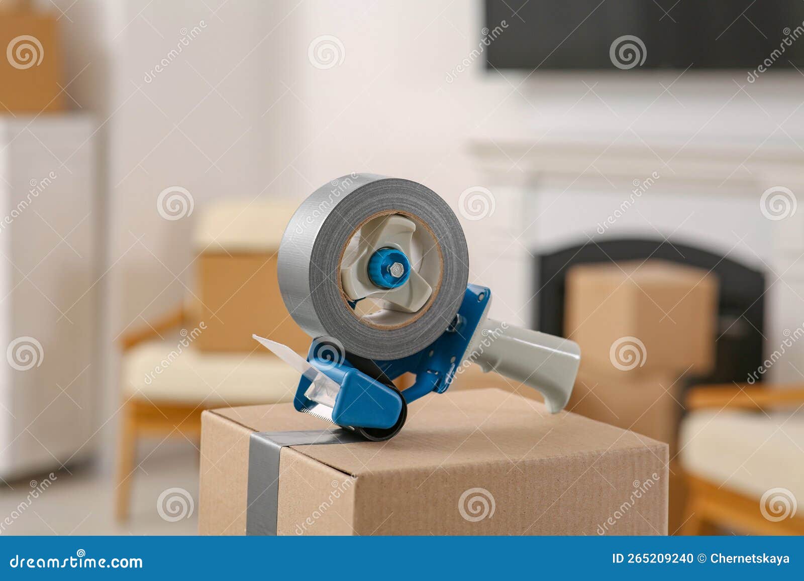 Dispenser with Roll of Adhesive Tape on Box Indoors Stock Photo - Image ...