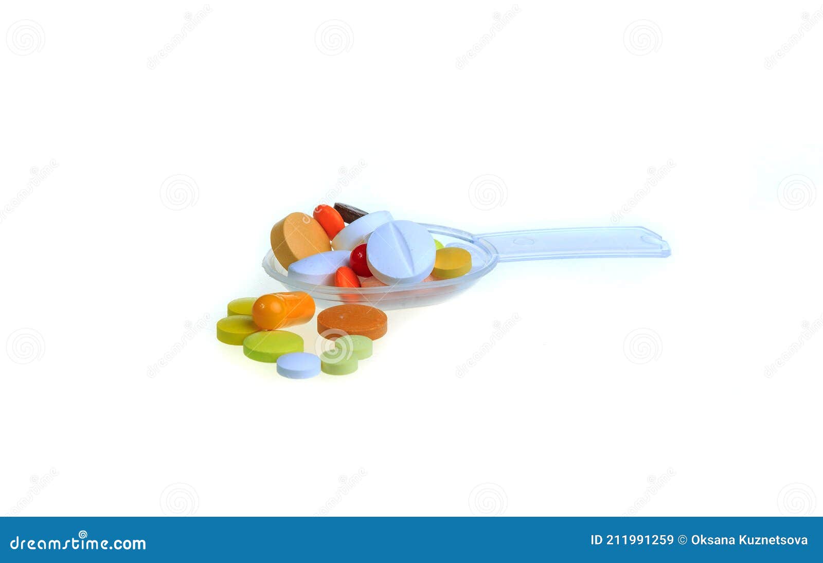 Dispenser Spoon with Tablets and Tablets and Capsules on a White ...