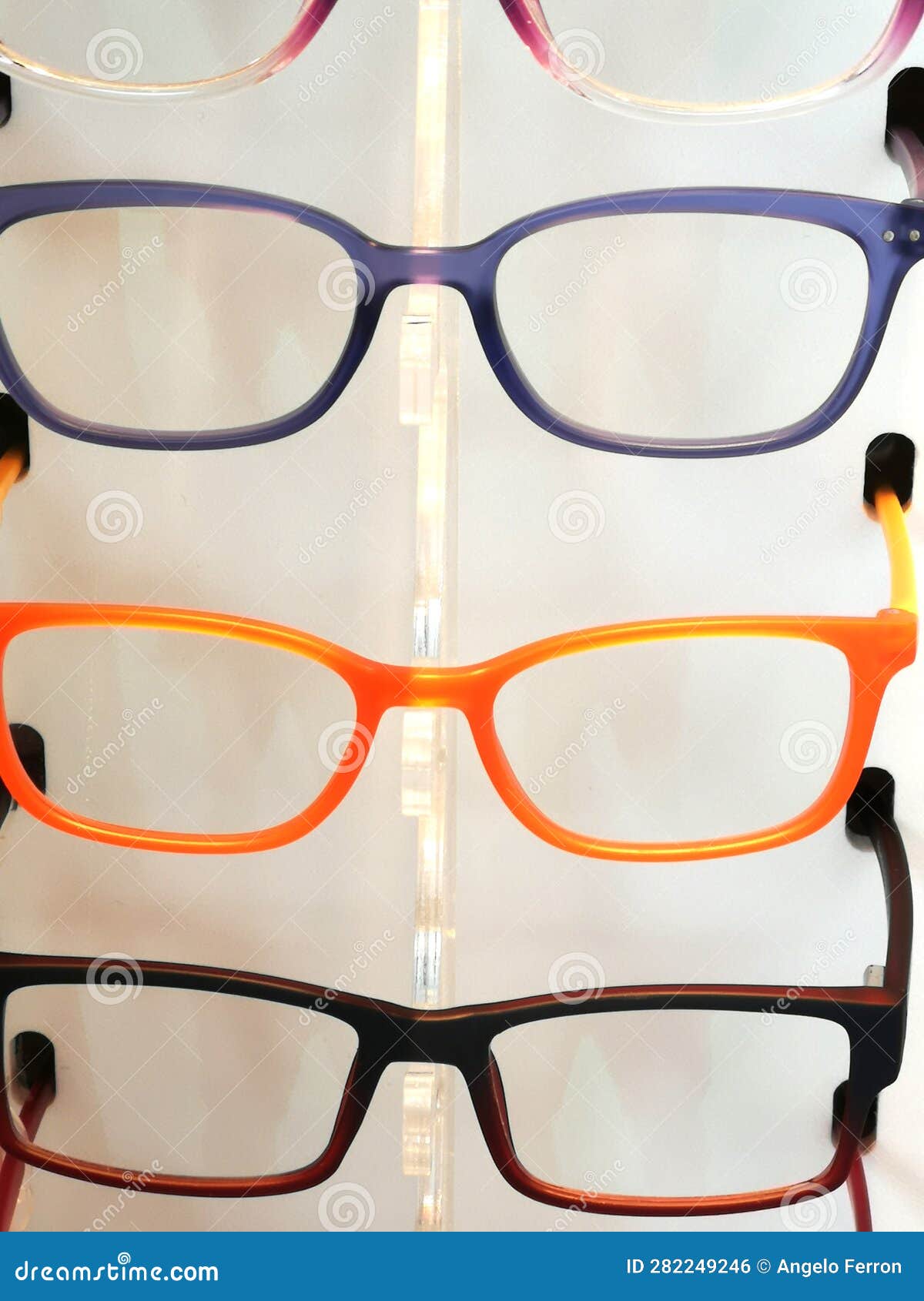 A Display Case for Colorful Frames and Eye Glasses with Buttons on Them ...