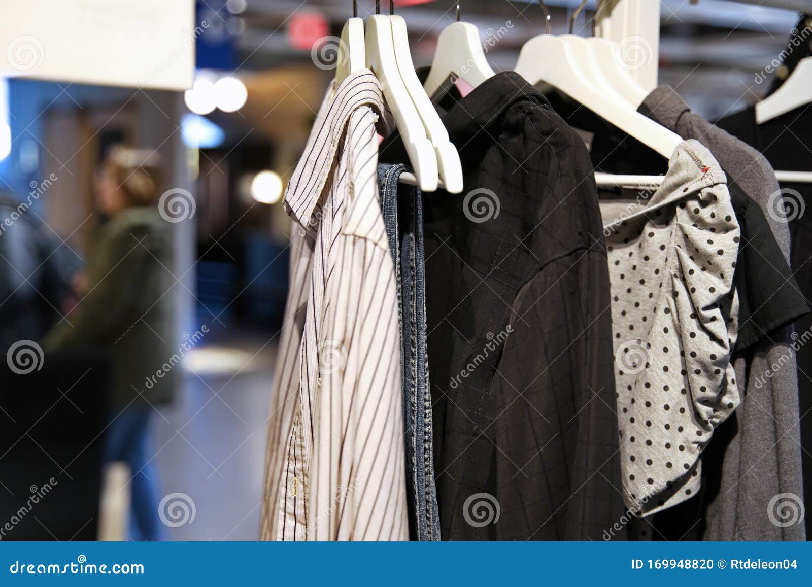 Display clothes on hangers stock photo. Image of clothing - 169948820