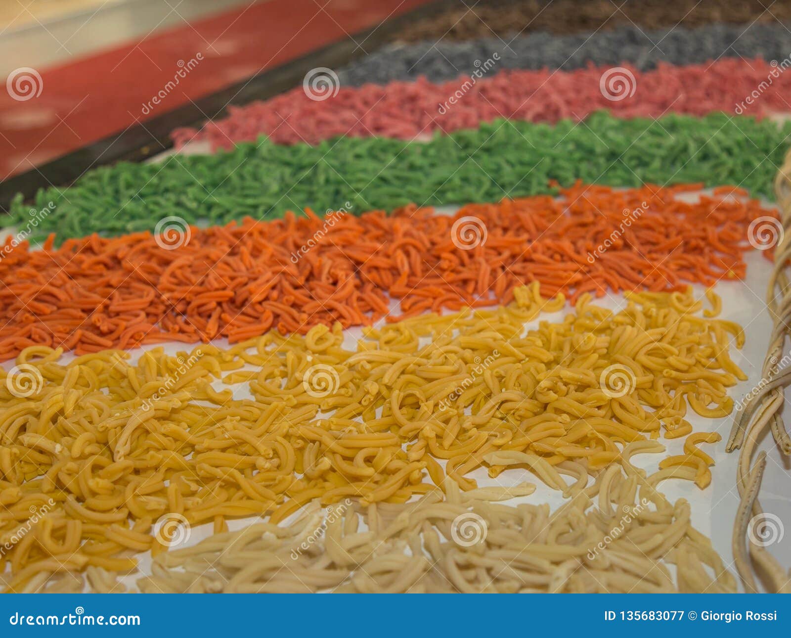 Display of a Food Store with Various Rows of Raw Coloured Pasta Stock ...