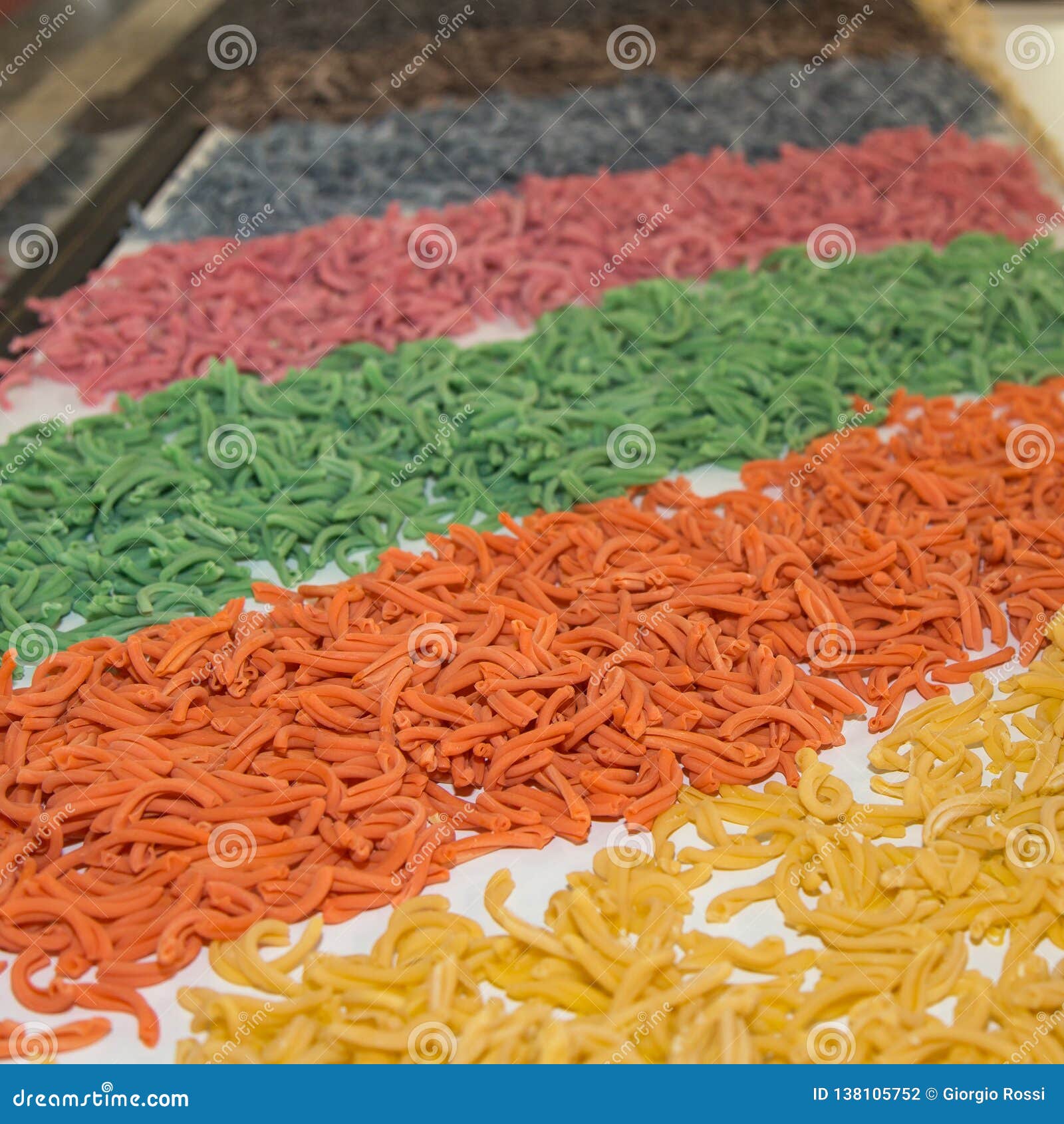Display of a Food Store with Various Rows of Raw Coloured Pasta Stock ...