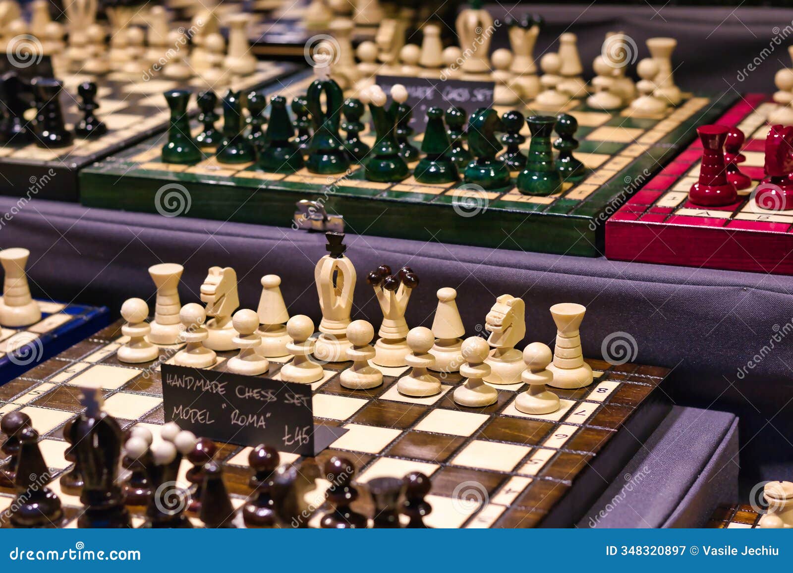 Display of Handmade Chess Sets with Varying Wood and Piece Colors Stock ...