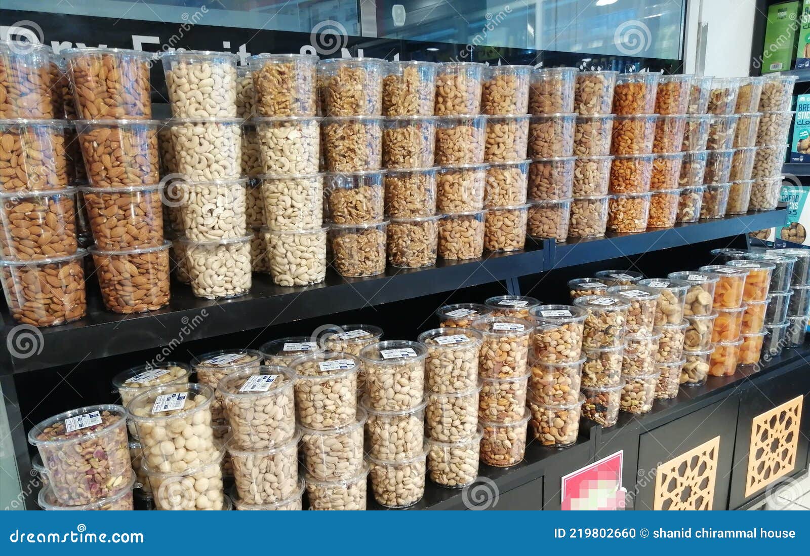 Display of packed dry nuts stock photo. Image of purchase - 219802660