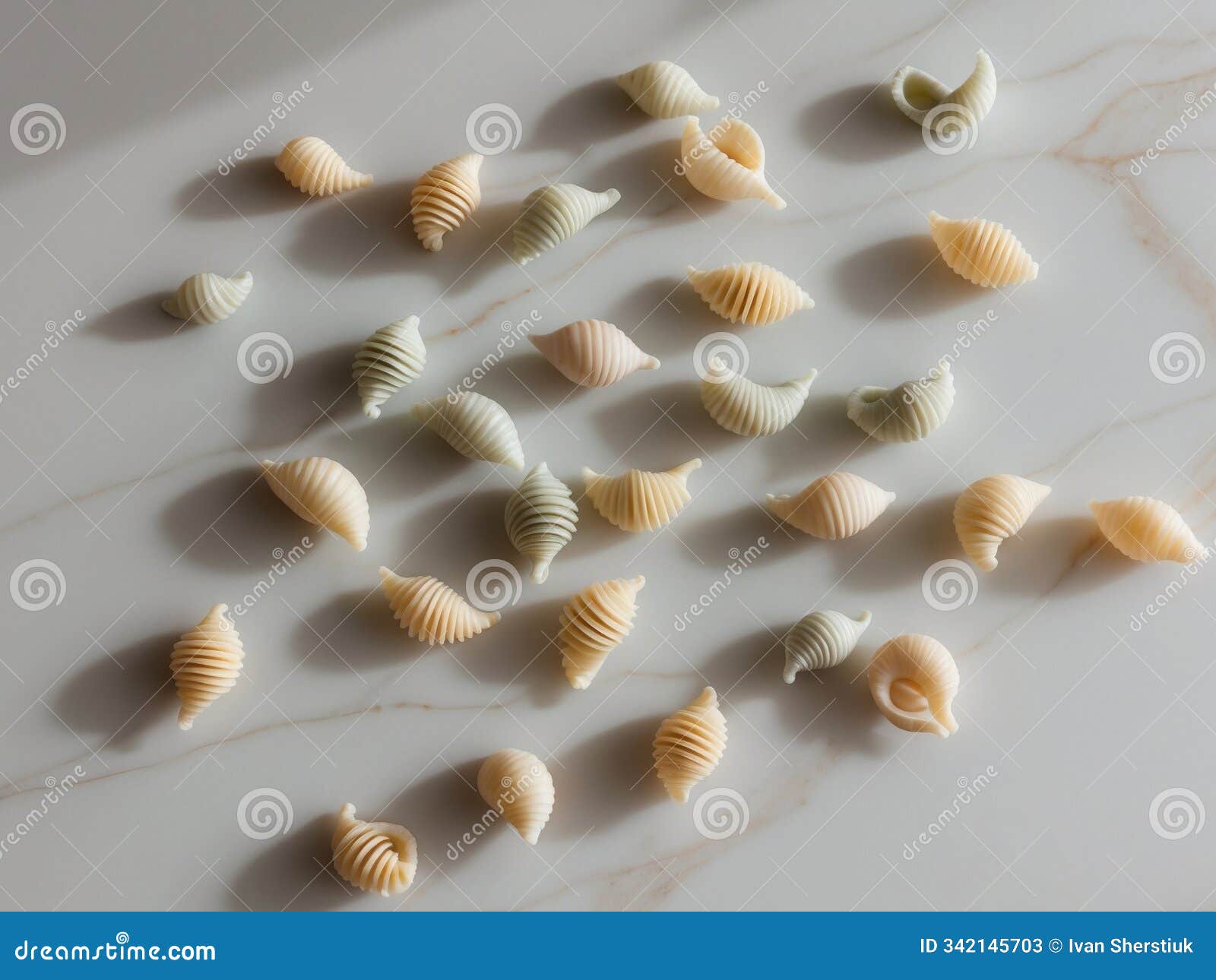 Display of Spiral and Shell Pasta in Pastel Colors on Marble. Stock ...