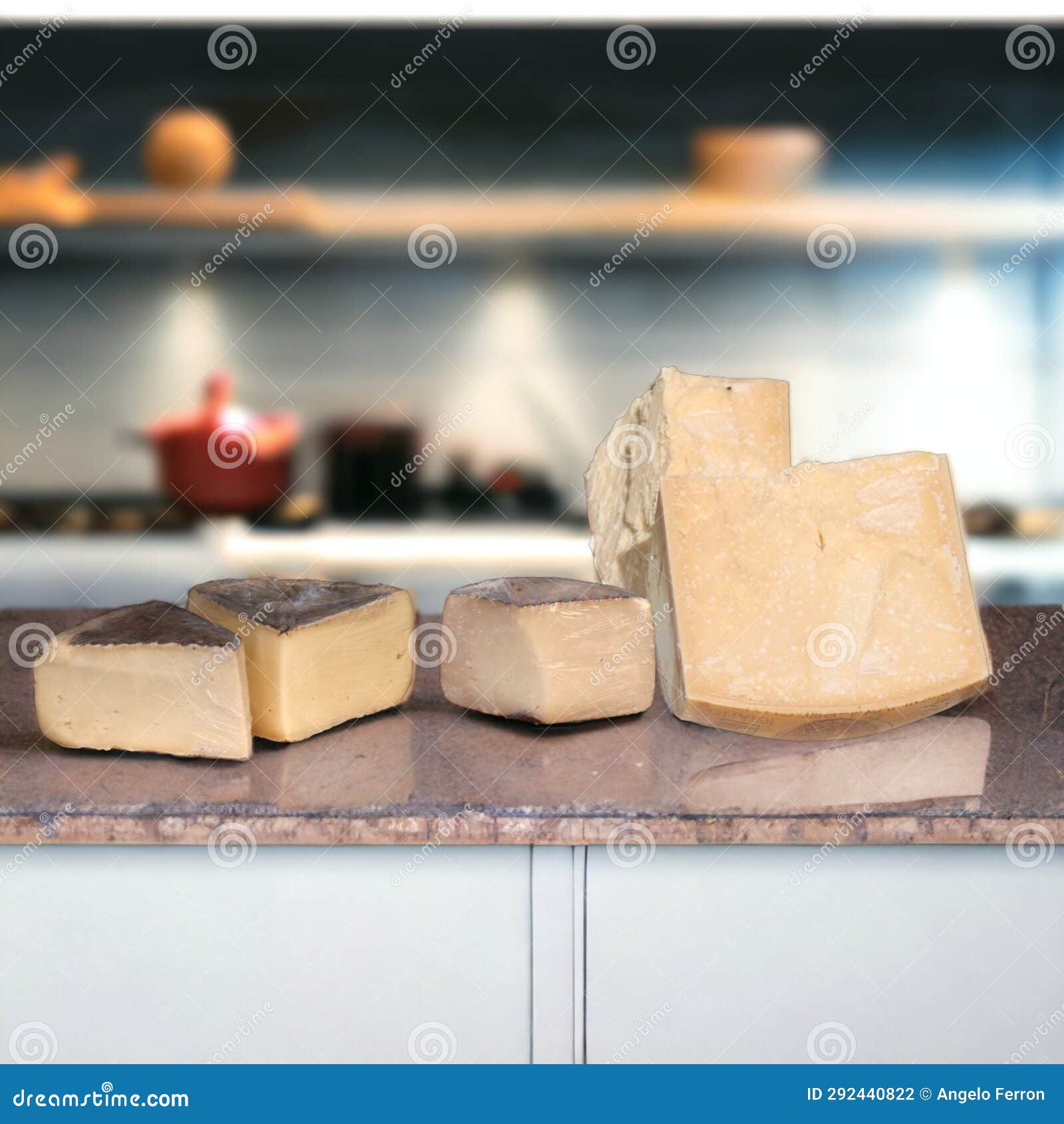 Display of Various Types of Cheese on the Kitchen Table- Stock Photo ...