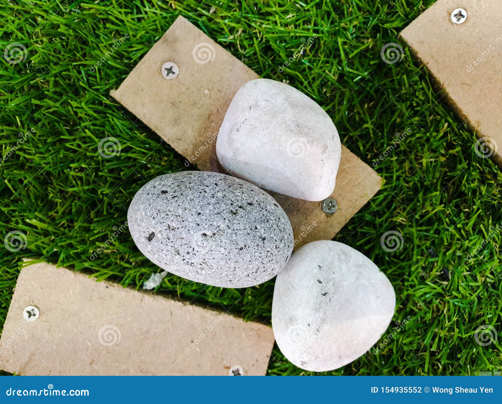 Display of Wood Pathway and Decorative Rocks on Grass Stock Photo ...