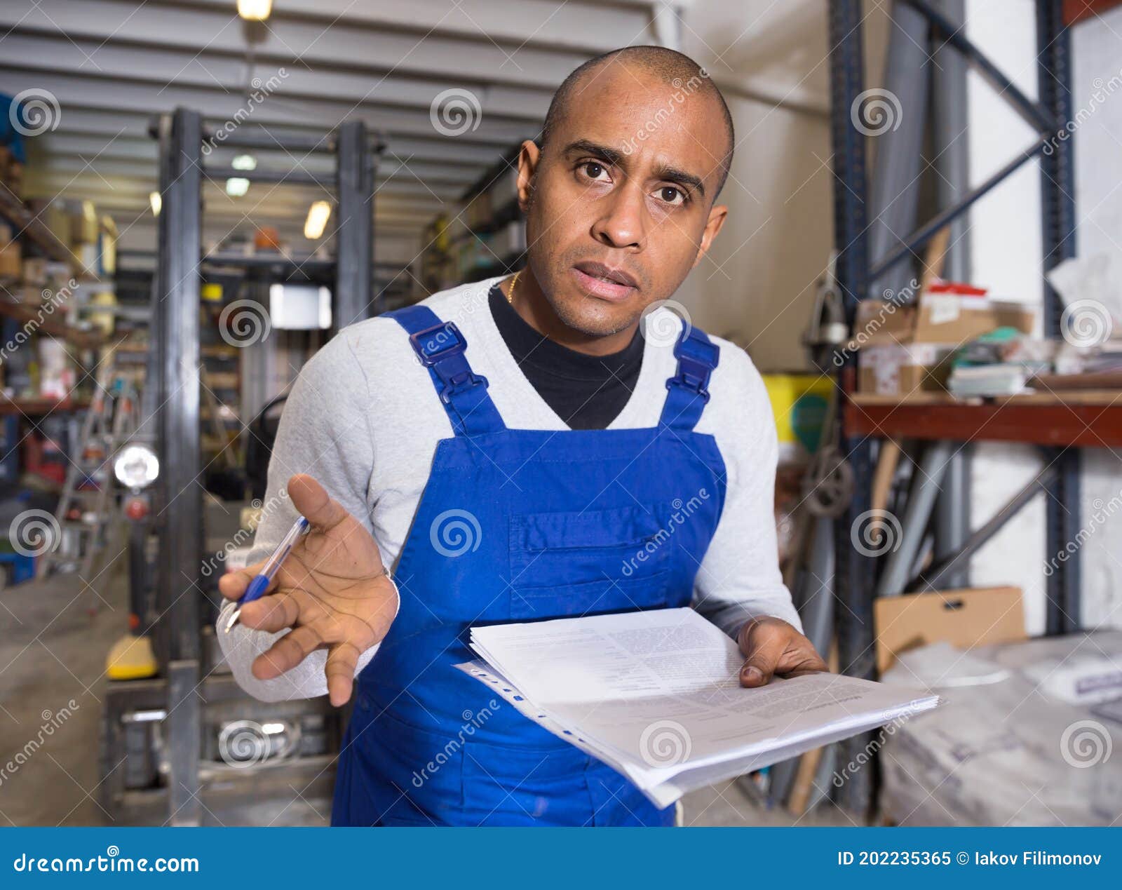 Displeased Warehouse Manager with Documents after an Audit in Hardware ...
