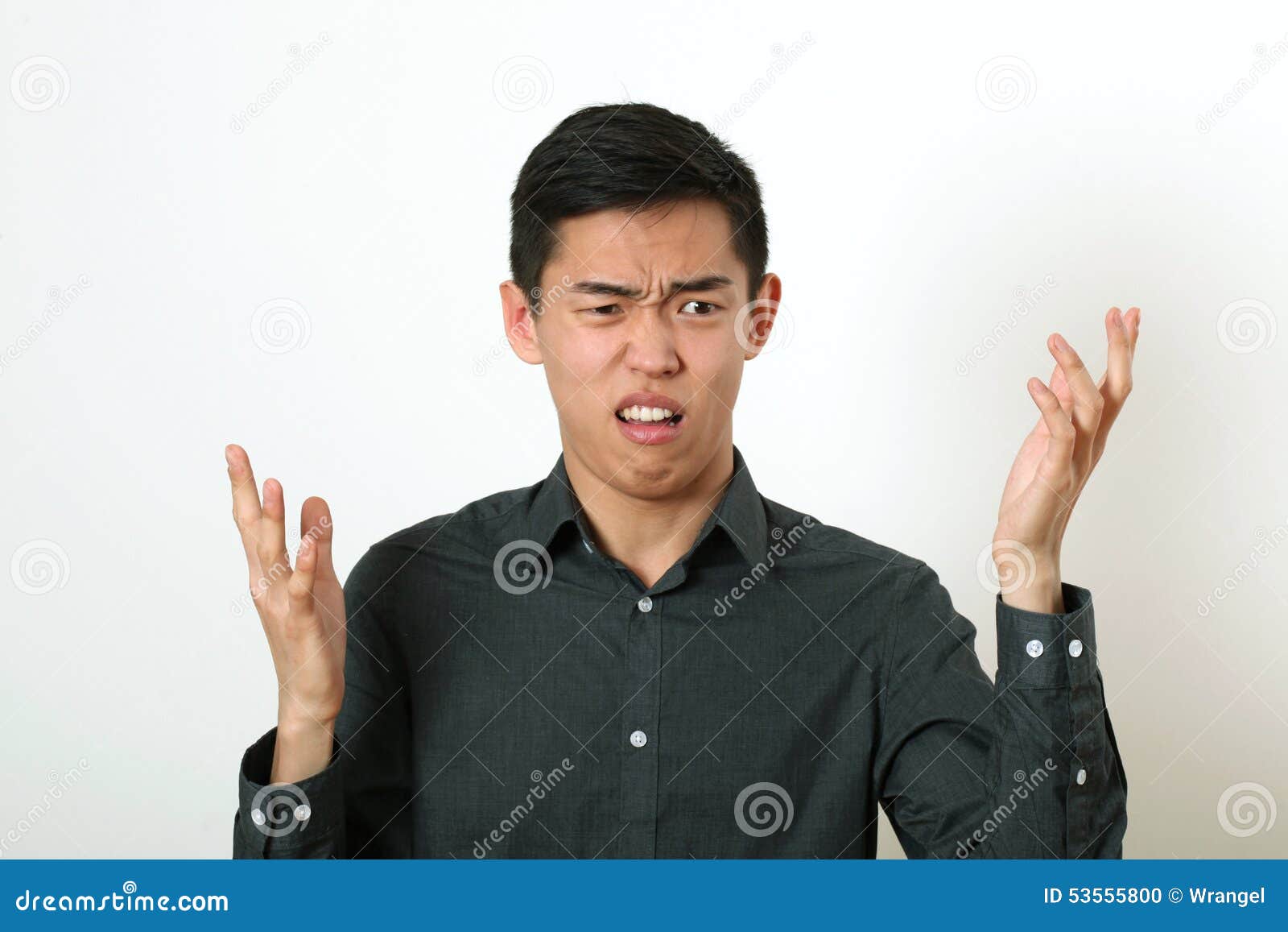 Displeased Young Asian Man Gesturing with Two Hands Stock Photo - Image ...