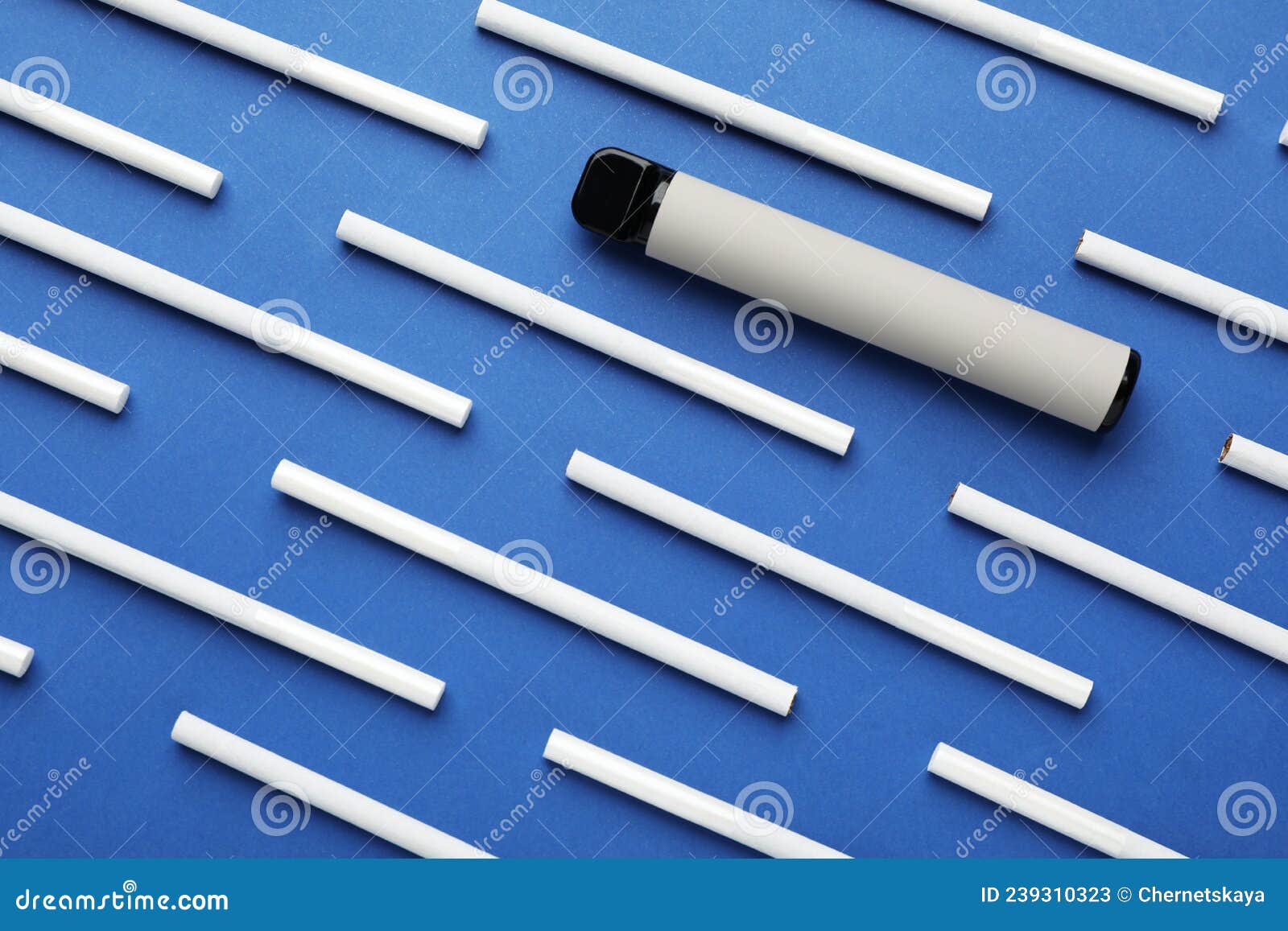 Disposable Electronic Smoking Device and Cigarettes on Blue Background ...
