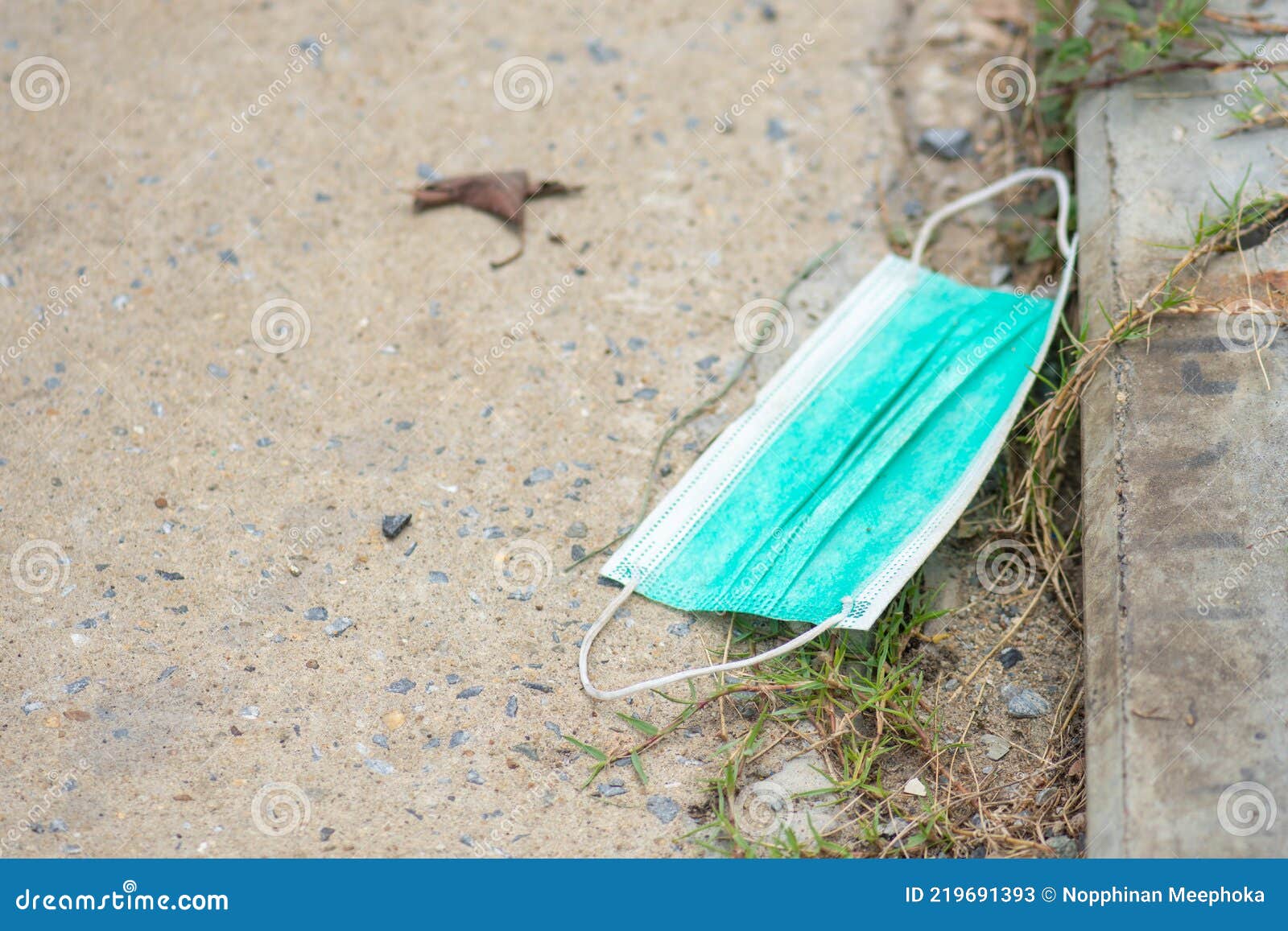 Disposable Face Mask on Pavement Dirty and Causing the Spread of ...