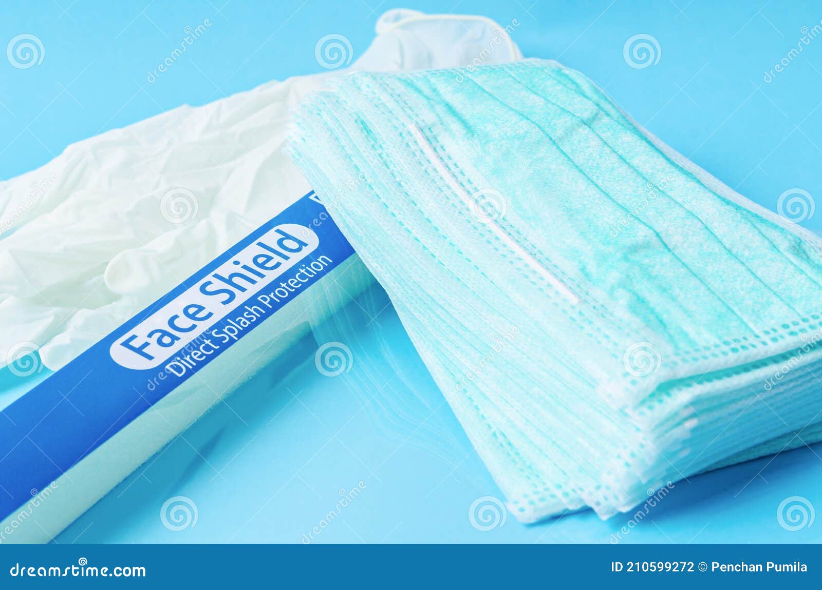 Disposable Face Mask, Face Shield and Gloves on Blue Background Stock ...
