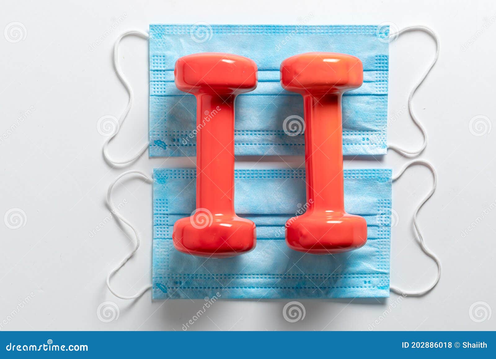 Disposable Mask and Dumbbells. Gym in Covid-19 Restriction Stock Photo ...