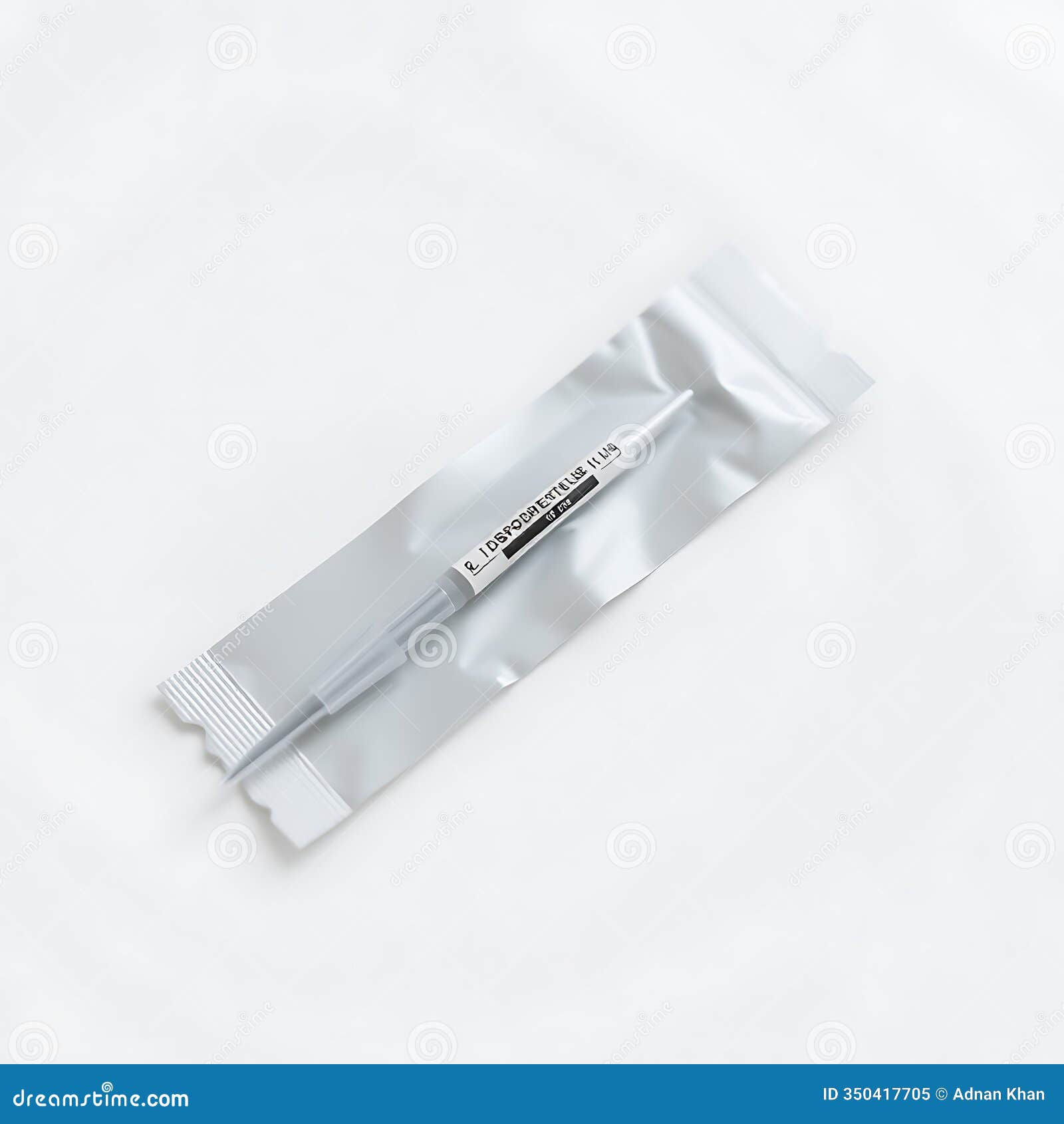 A Disposable Needle in Sterile Packaging Placed on a White Surface ...