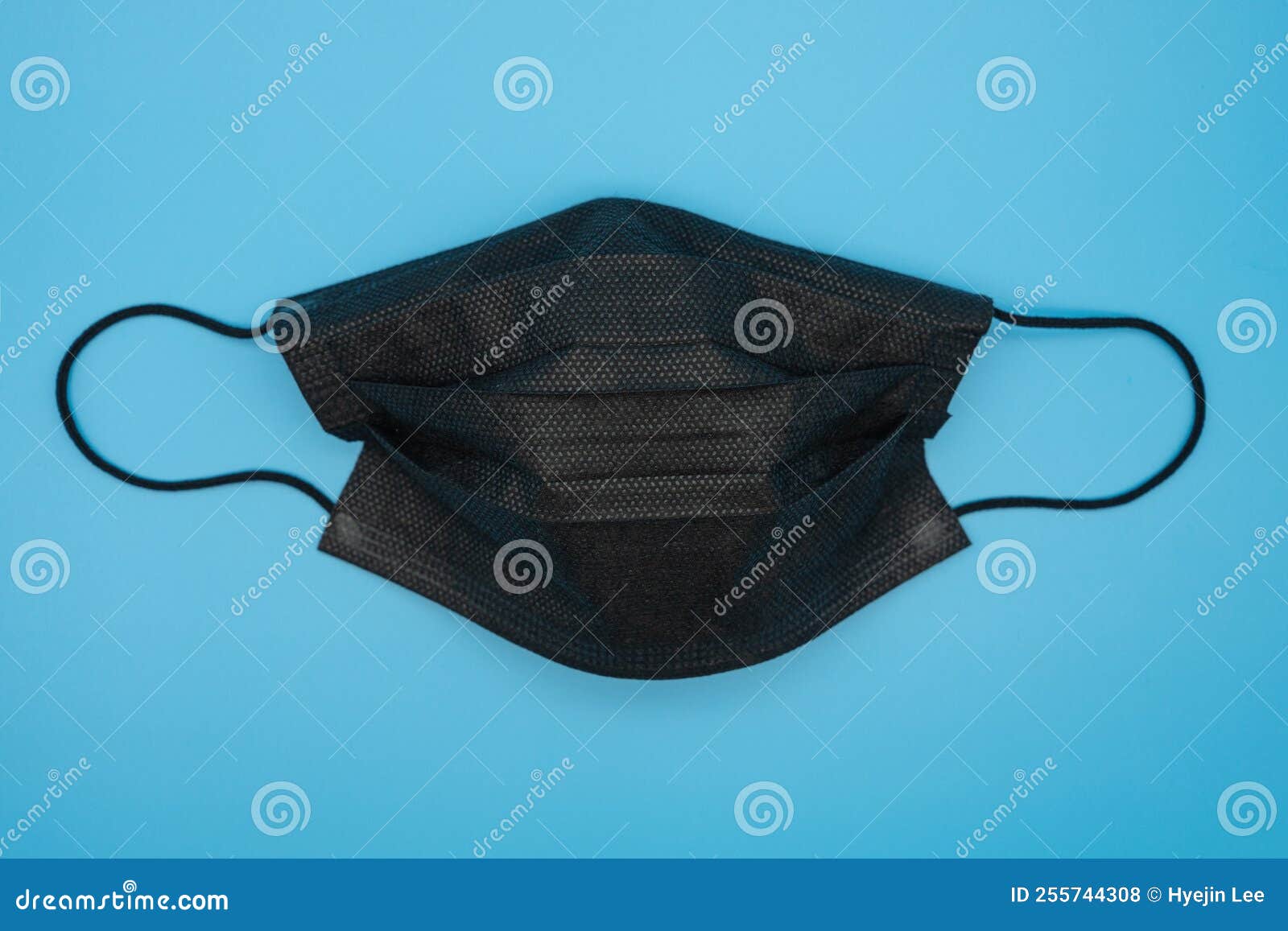 Disposable Protective Mask on a Blue Background Stock Photo - Image of ...