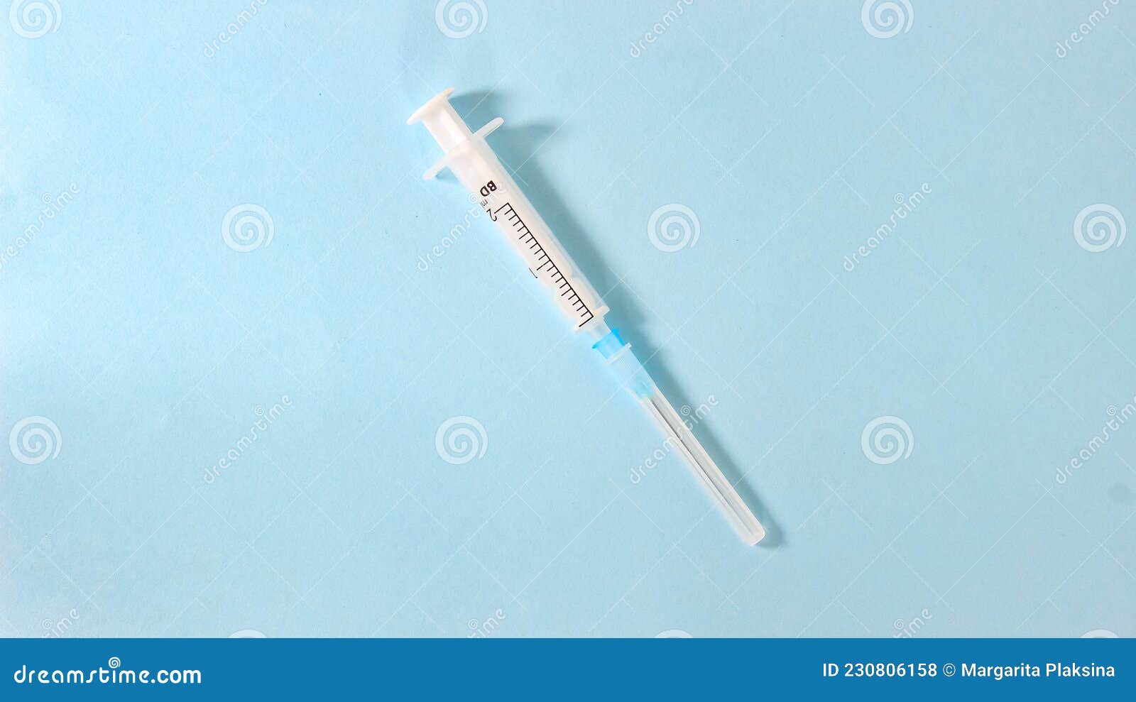 A Disposable Syringe on a 2 Ml Blue Surface Stock Photo - Image of ...