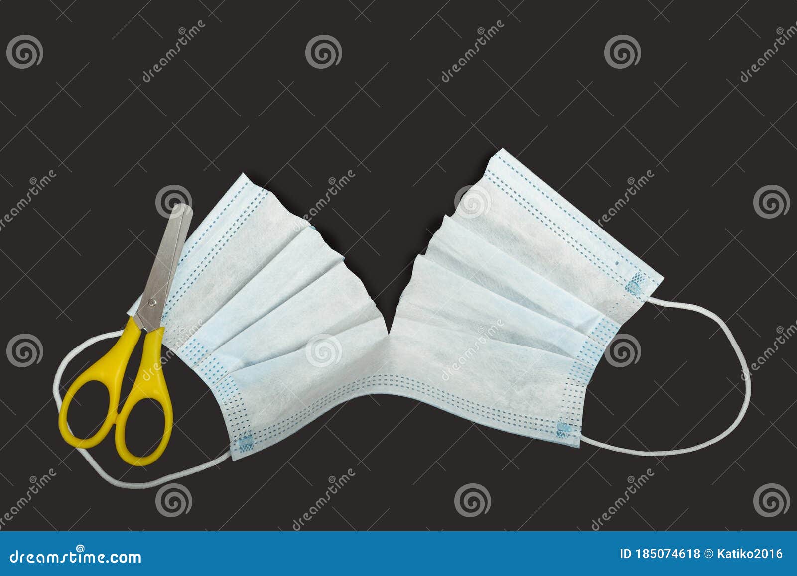 Disposal Protective Face Mask Cut in the Middle and Scissors. Concept ...
